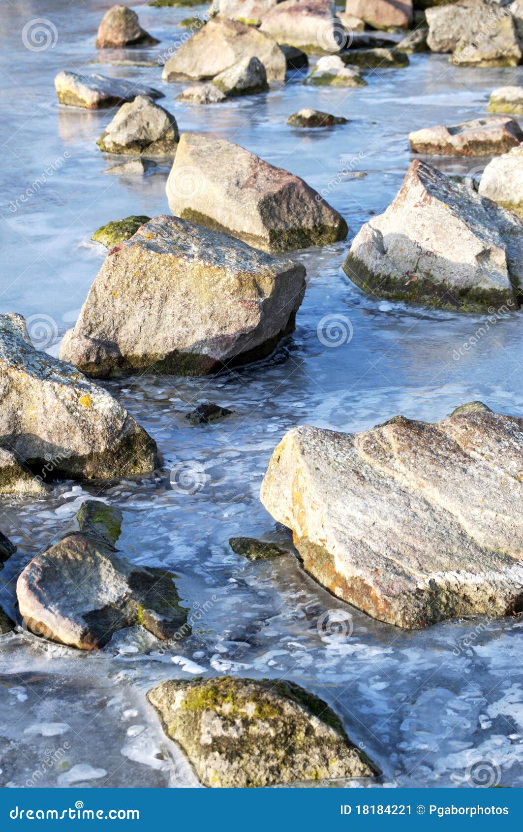 Stones in the frozen lake stock image. Image of black - 18184221