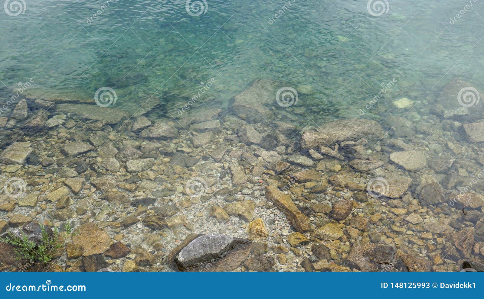 Stones in the lake water stock image. Image of abstract - 148125993