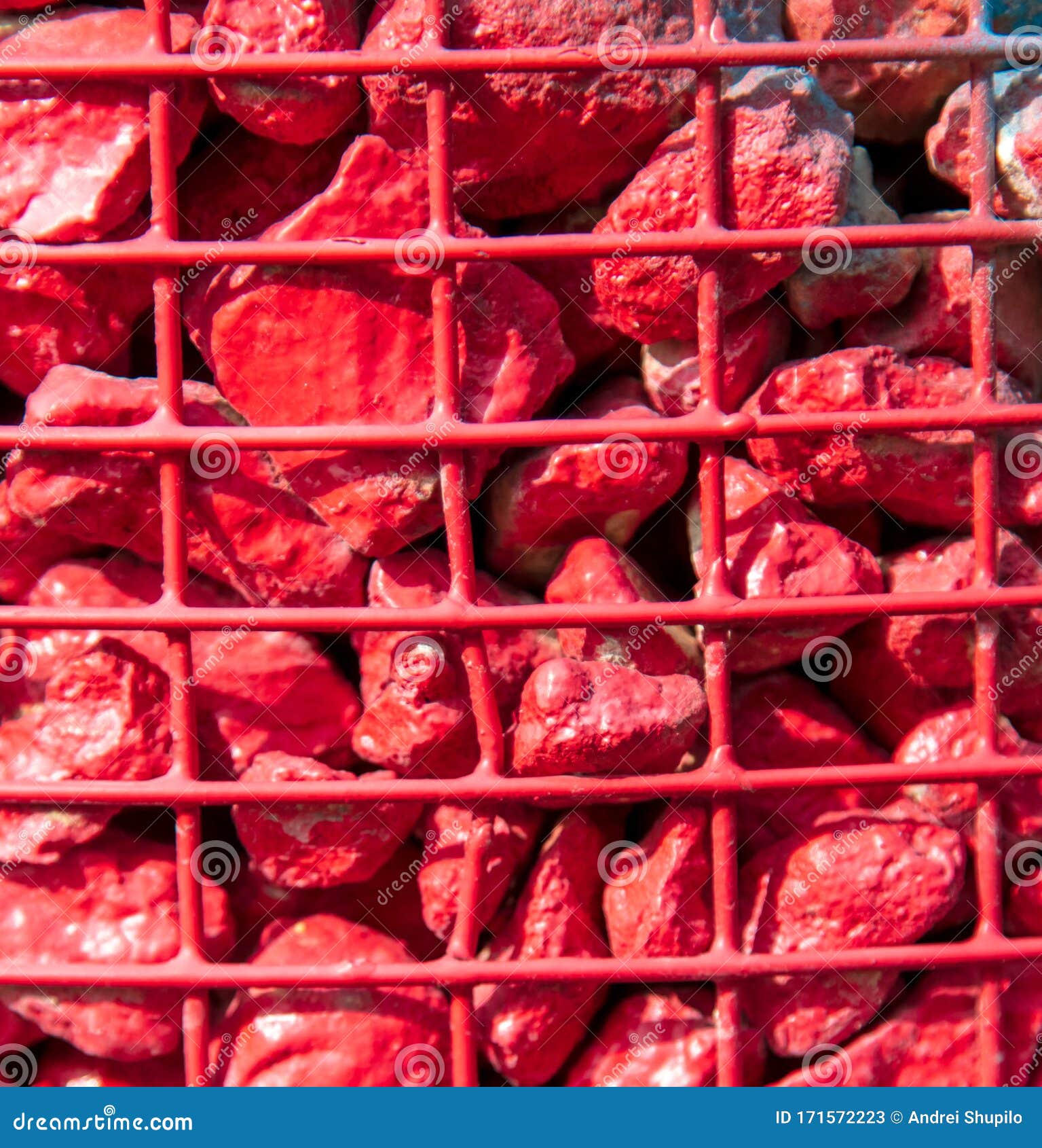 Stones Painted with Red Paint in a Metal Grid As a Background Stock ...