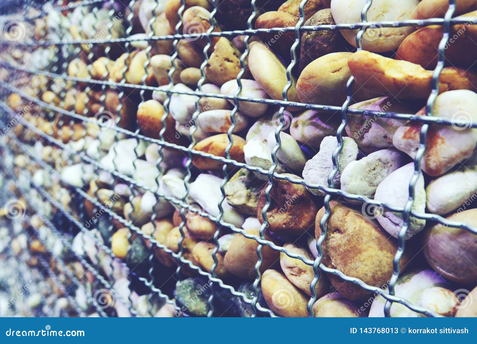 Stones and Pebbles Wall in Wire Mesh Stock Image - Image of exterior ...