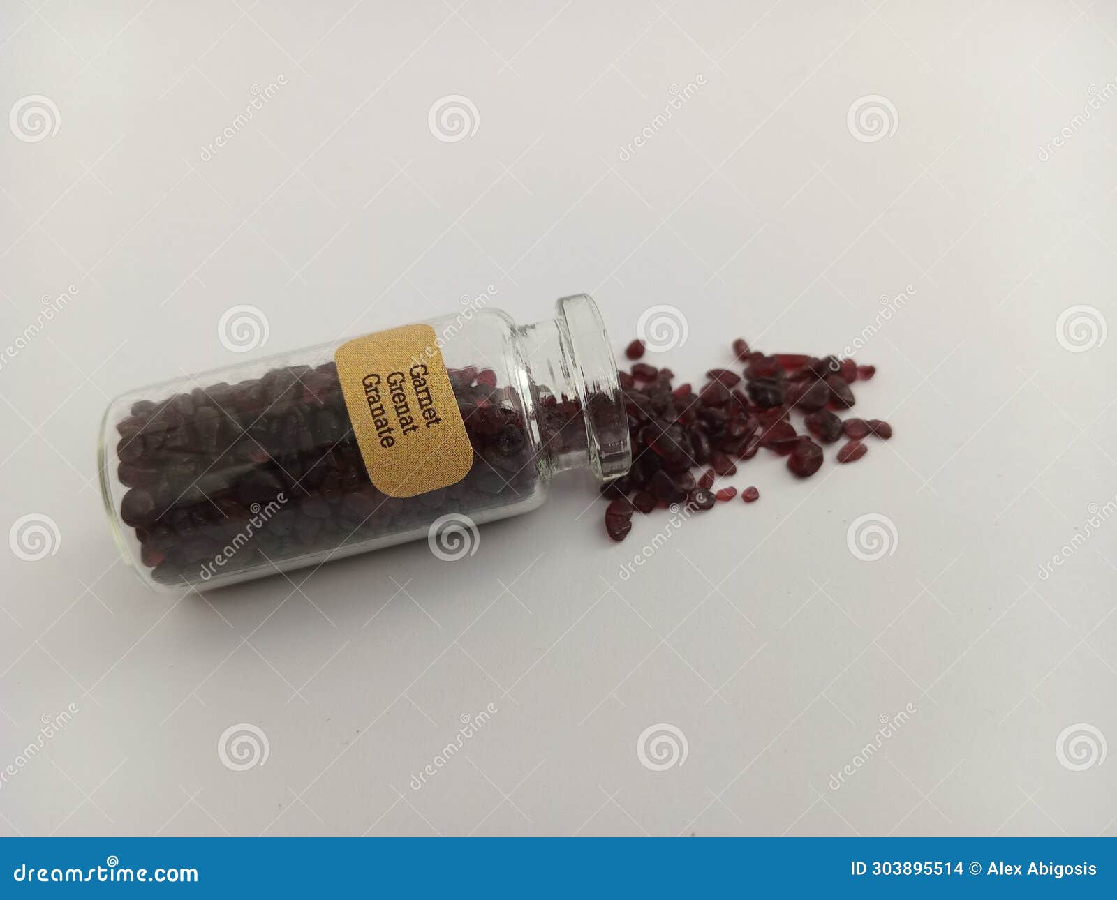 Stones and Rocks Spilling from a Glass Bottle on a White Background ...