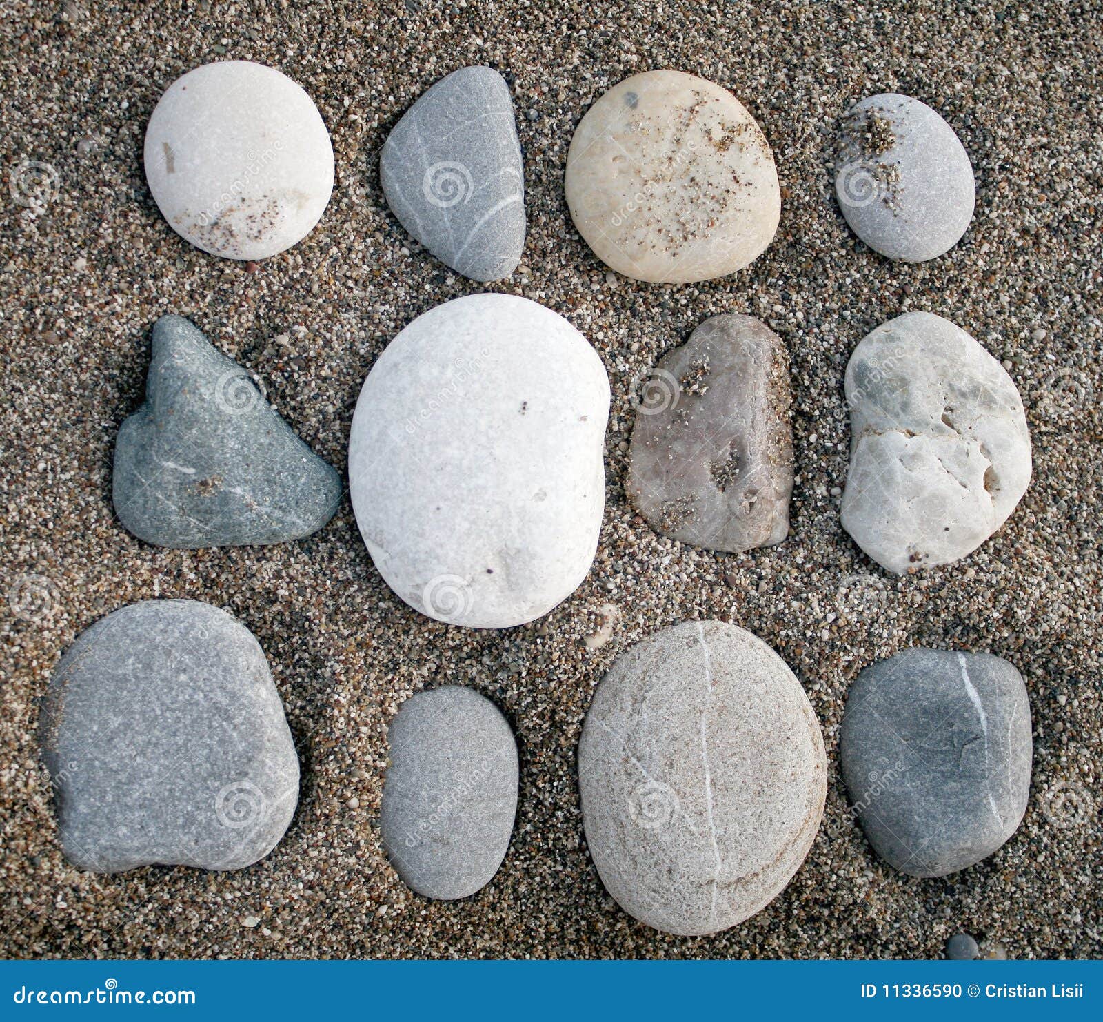 Stones on sand stock photo. Image of granules, sand, stone - 11336590