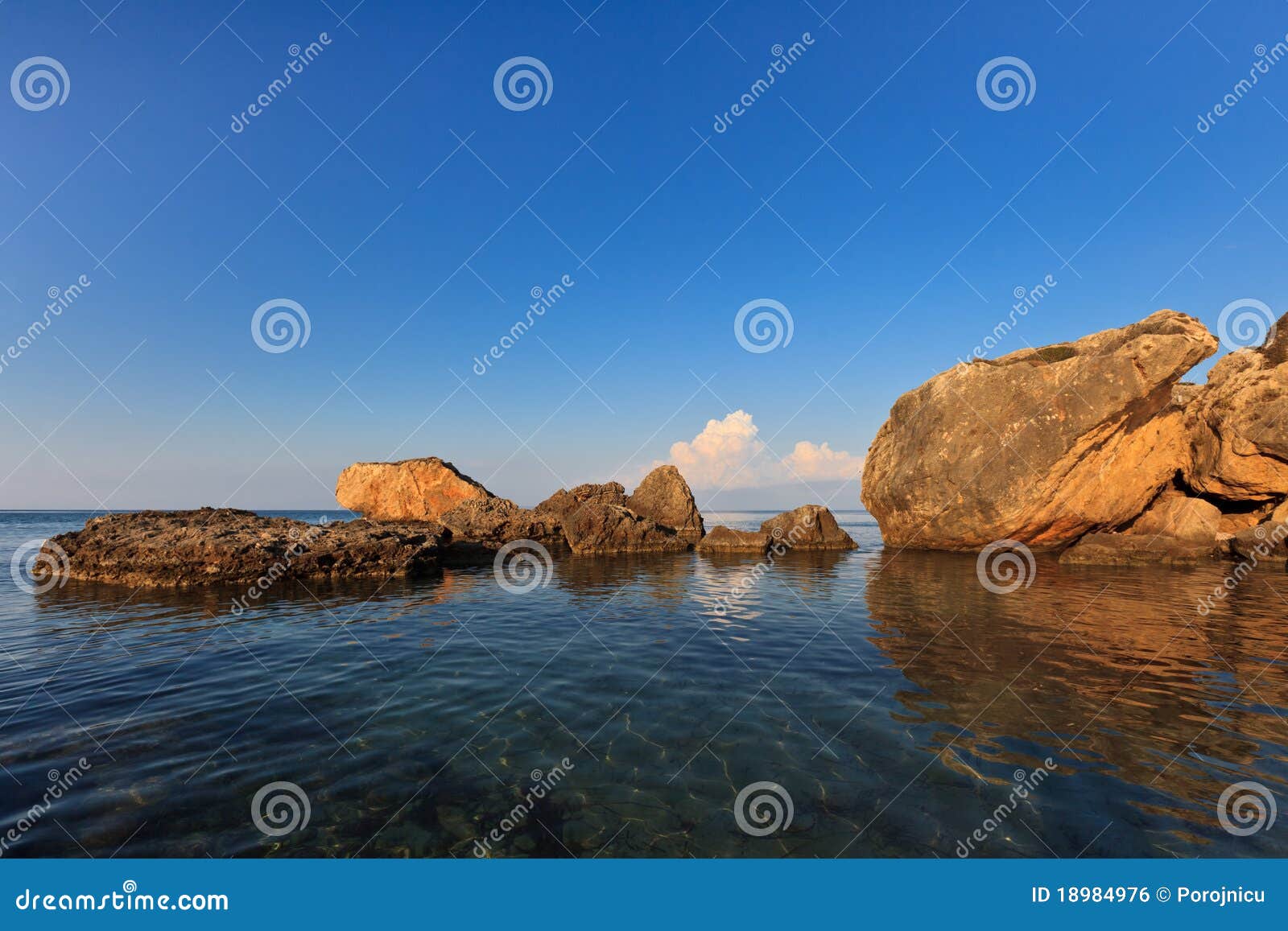 Stones in sea stock photo. Image of blue, summer, coast - 18984976