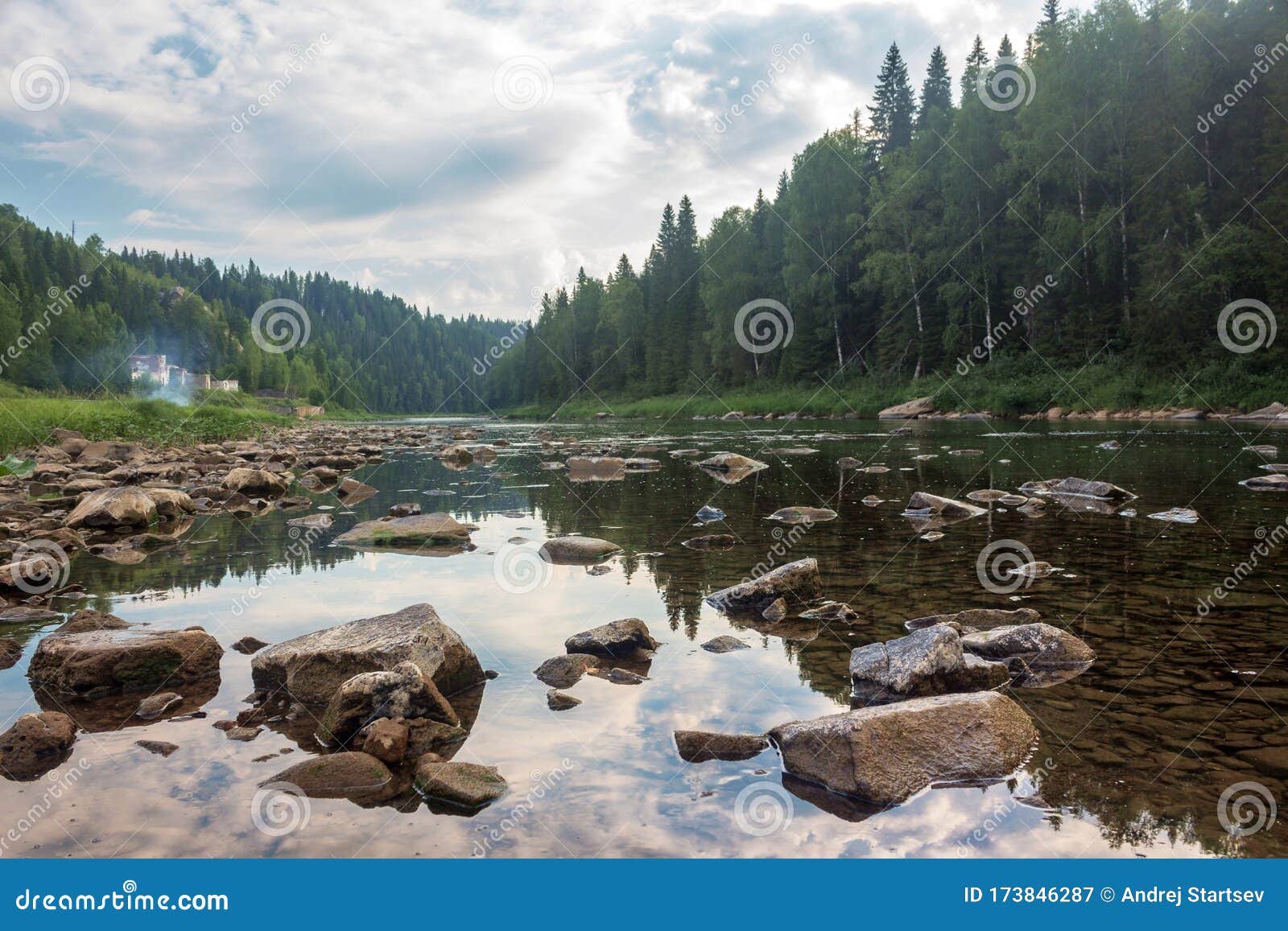 Stones in a shallow river stock image. Image of scenery - 173846287