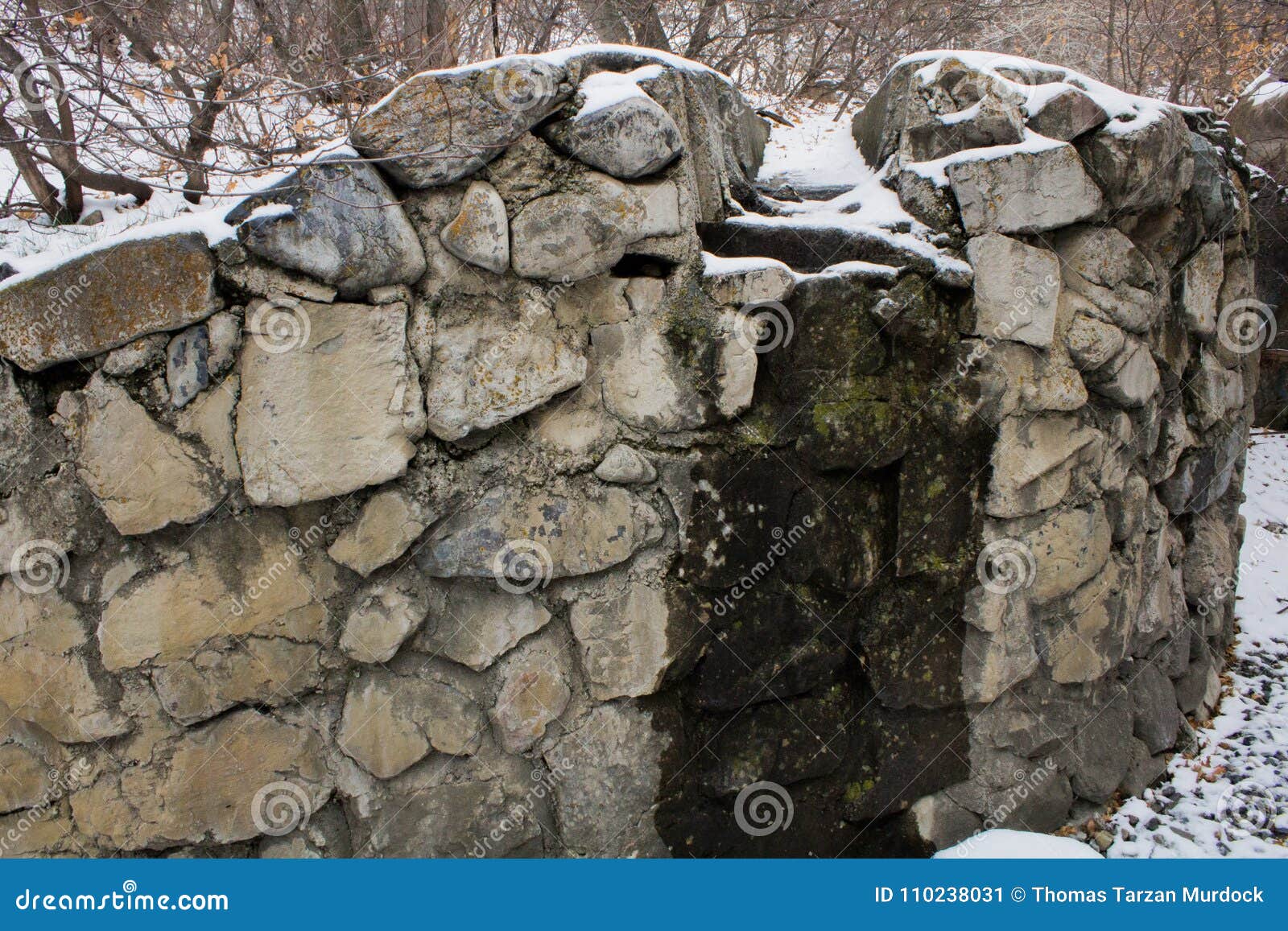 Stones in the Snow Along a Path with a Stone Wall Lining the River ...