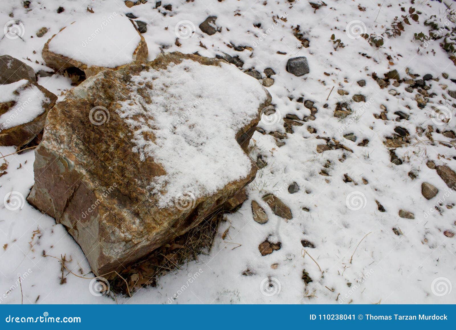 Stones in the Snow Along a Path with a Stone Wall Lining the River ...