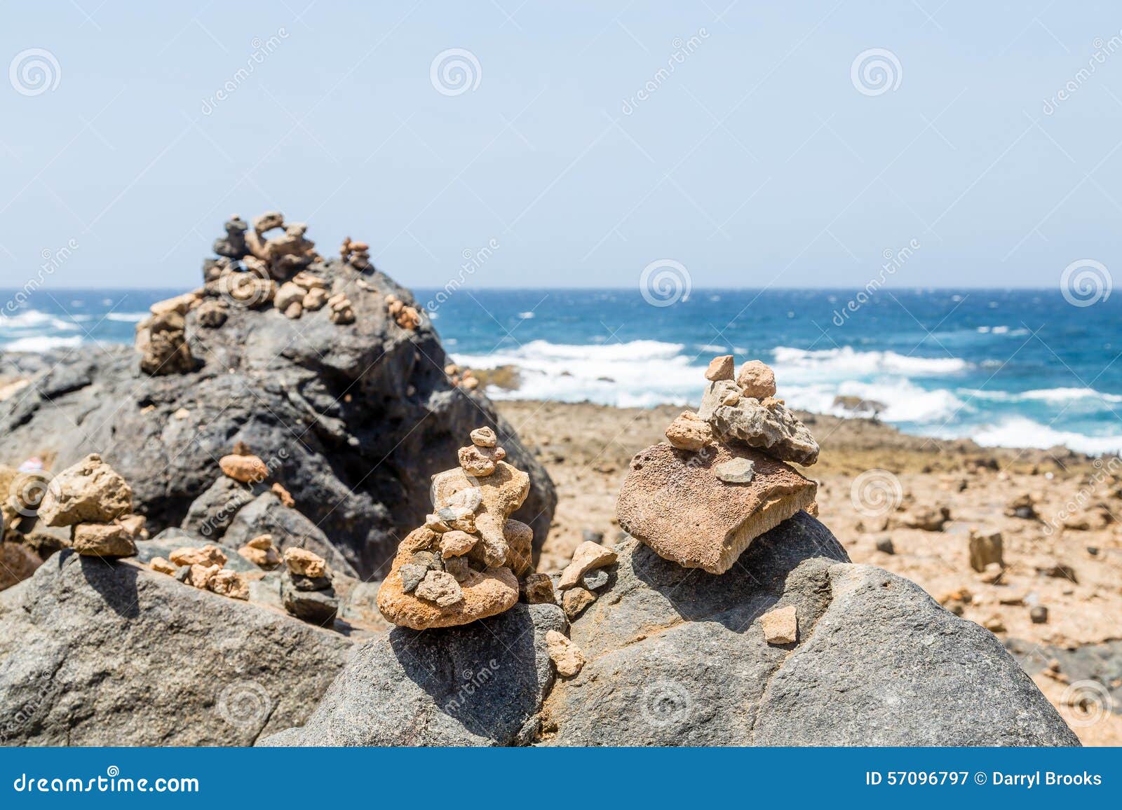 Stones Stacked on Black Volcanic Rock Stock Image - Image of rock ...