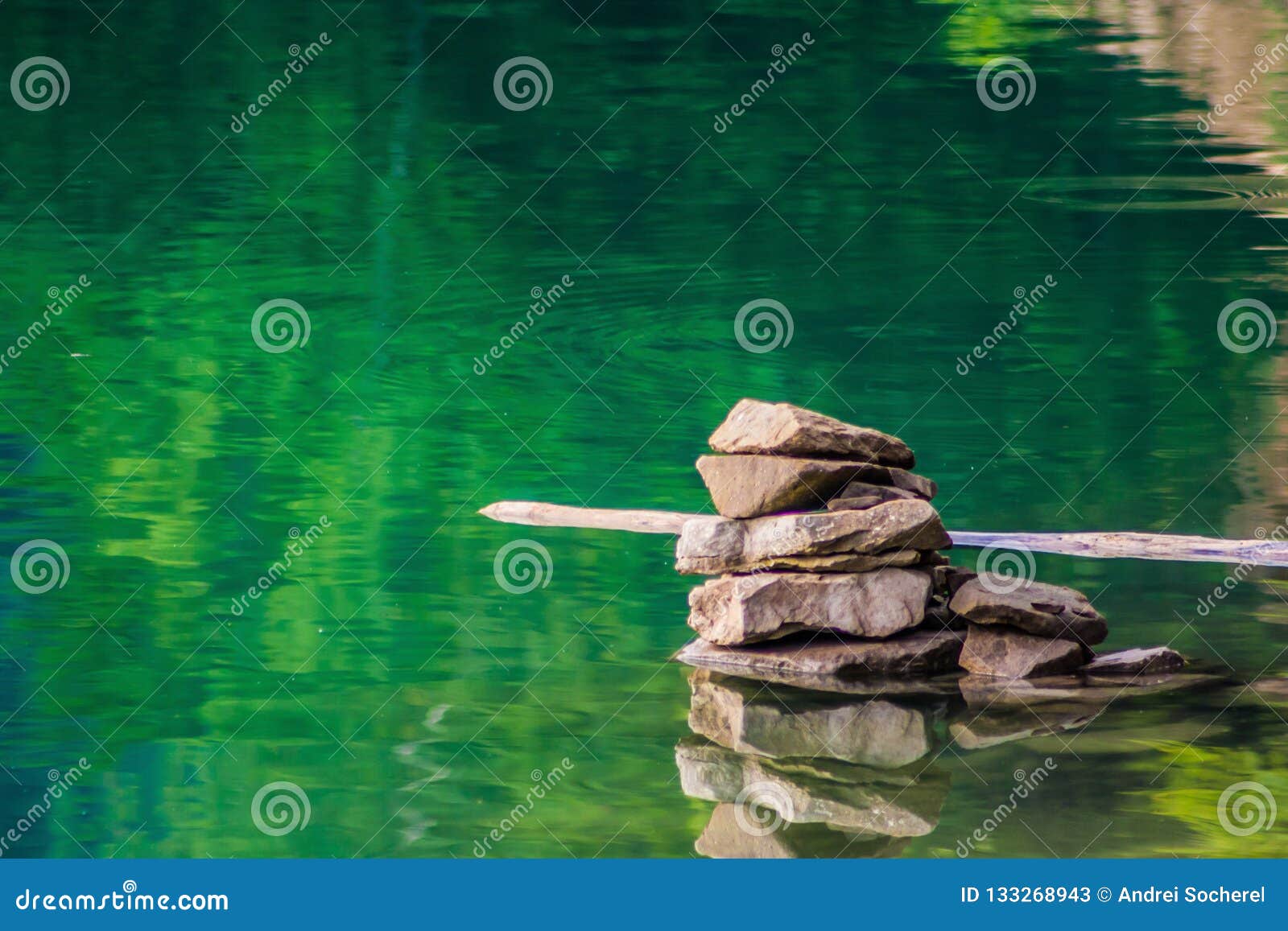 Stones stacked in the Pond stock image. Image of lake - 133268943