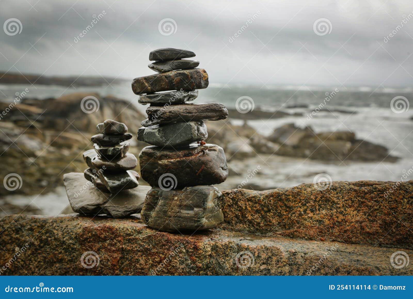 Stones Stacked on a Rocky Shoreline Stock Photo - Image of dramatic ...