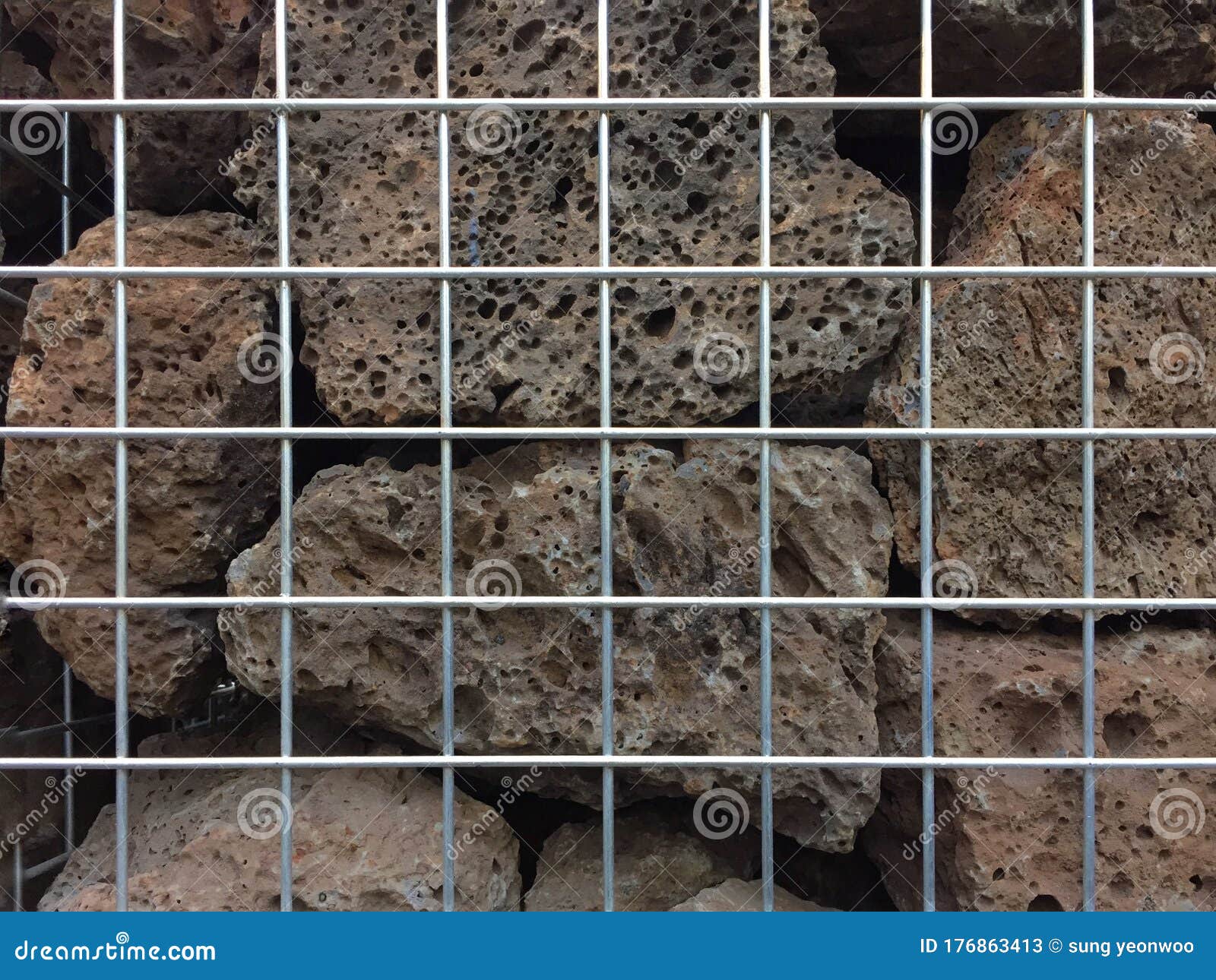 Stones Stacked Tightly in a Wire Mesh Stock Image - Image of rock ...