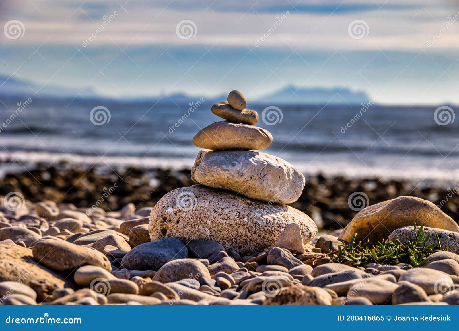 Stones Stacked in Towers on a Pebble Beach Stock Image - Image of ...