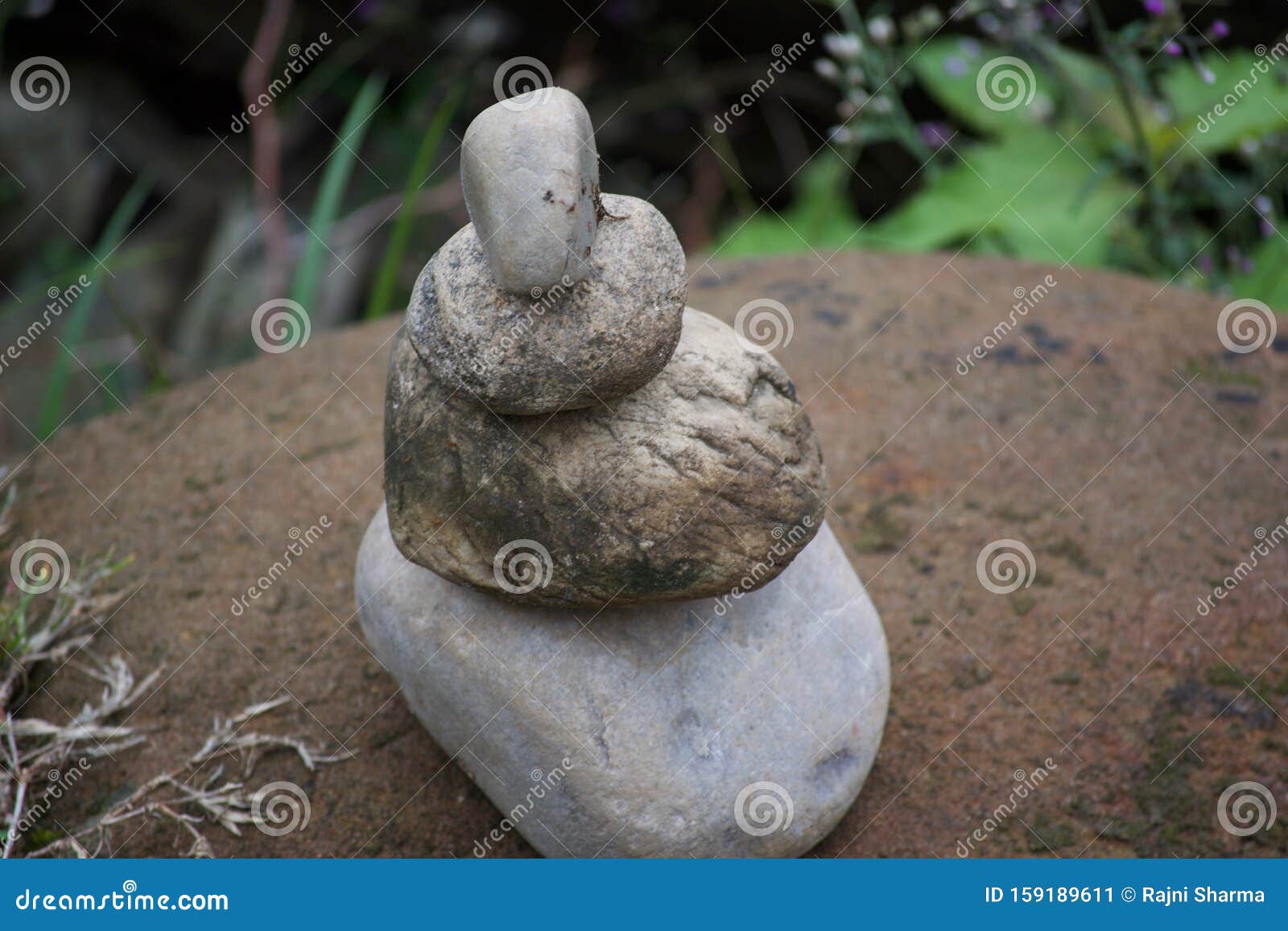 Stones stacked up on rock stock image. Image of pile - 159189611