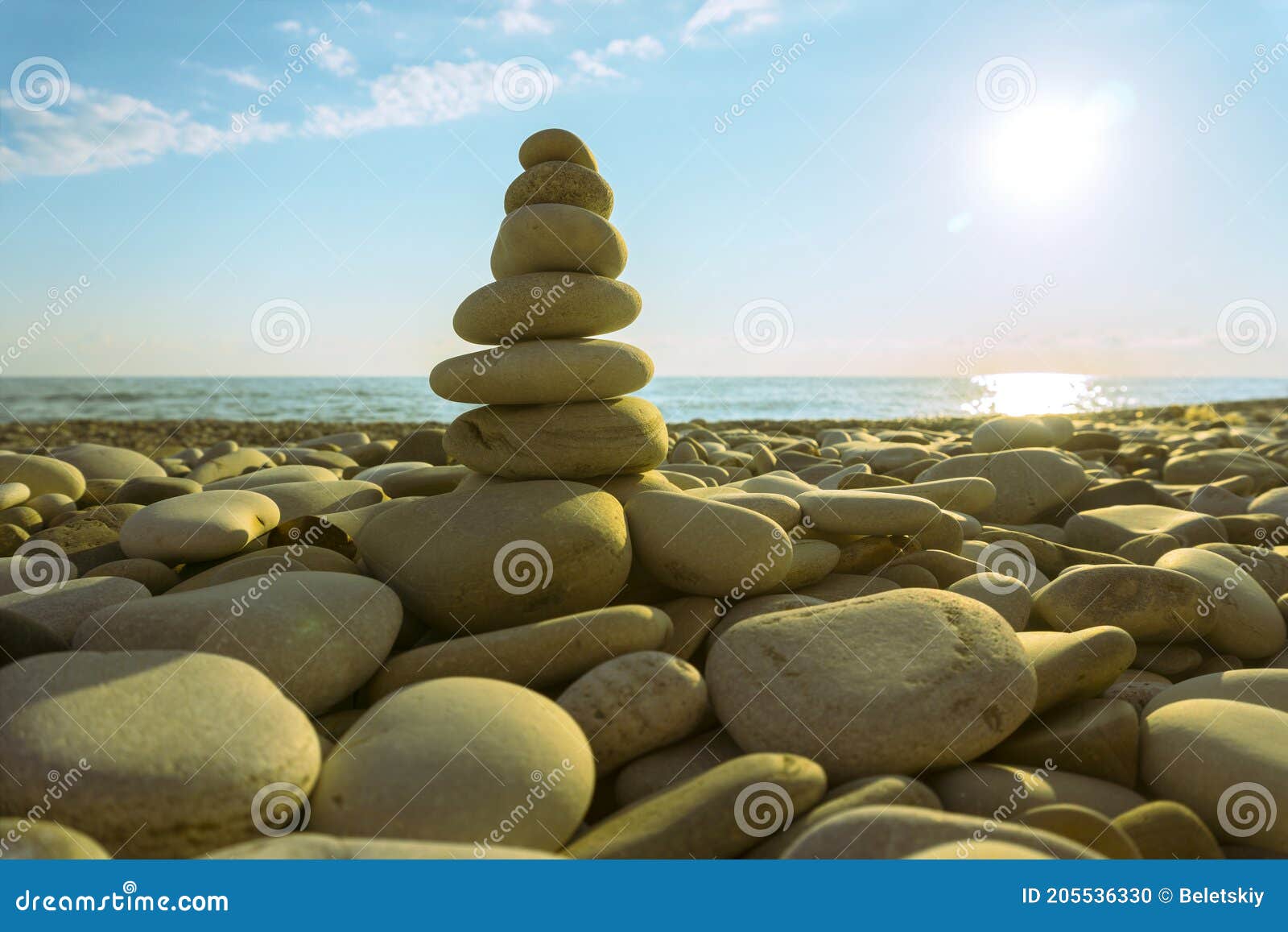 The Stones are Stacked Vertically on the Seashore Stock Photo - Image ...