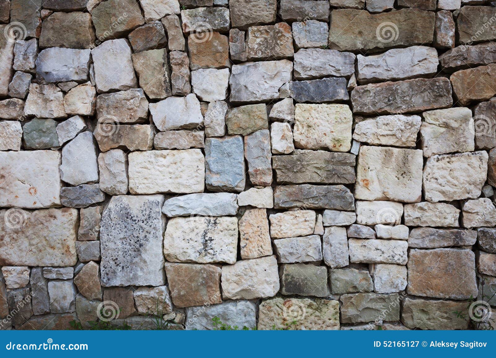 Stones stacked in a wall stock image. Image of building - 52165127