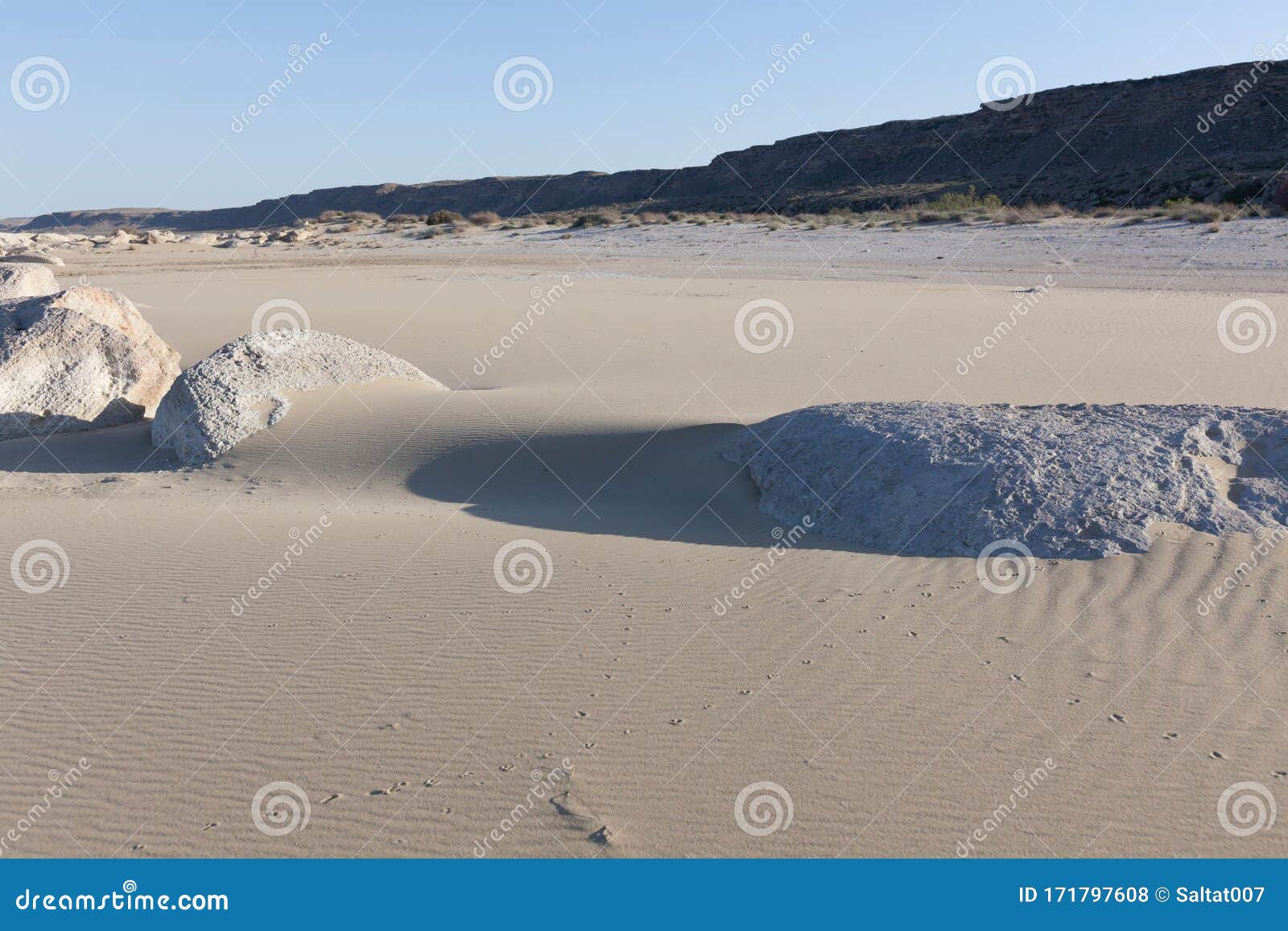 Stones Sticking Out of Sand. Sand Texture. Background from Fine Sand ...