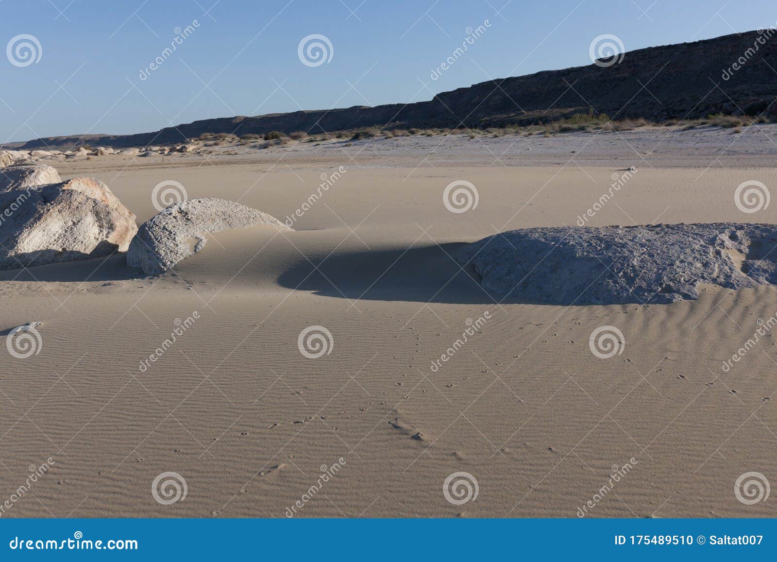 Stones Sticking Out of Sand. Sand Texture. Background from Fine Sand ...