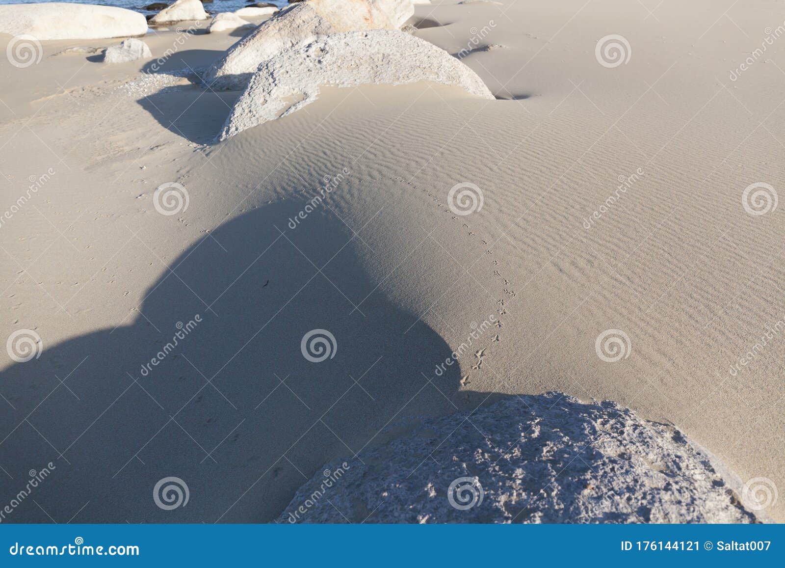 Stones Sticking Out of Sand. Sand Texture. Background from Fine Sand ...