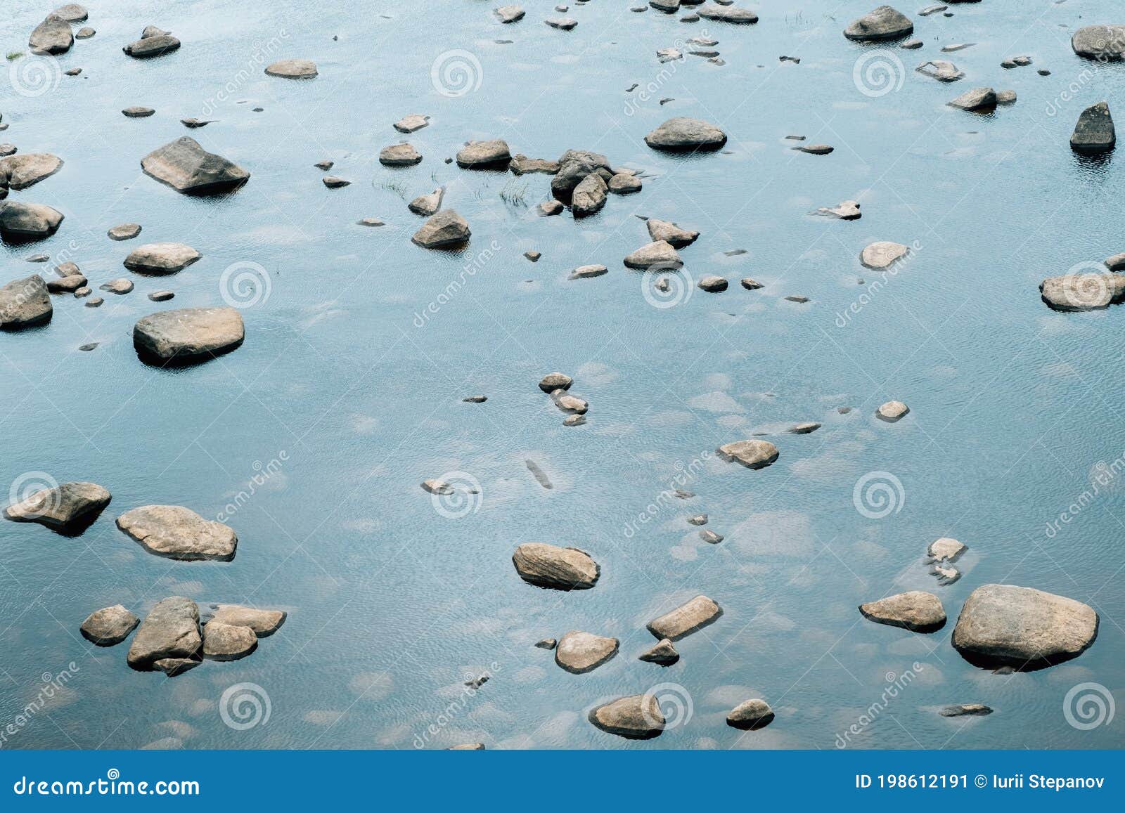 Stones and Their Reflections in the Lake Water Stock Image - Image of ...