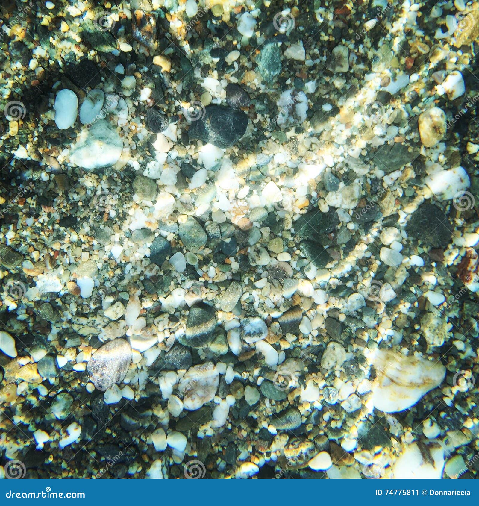 Stones under the sea stock image. Image of ripple, bright - 74775811