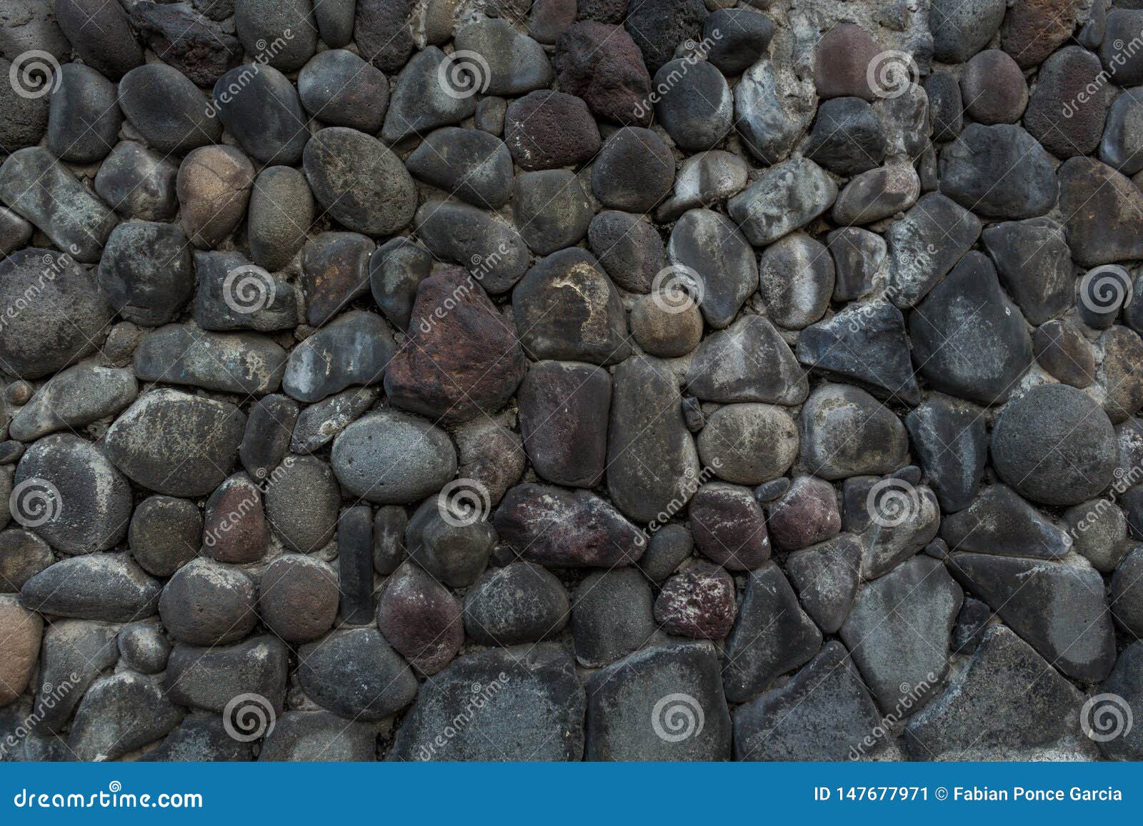 Wall of irregular stones stock image. Image of granite - 147677971