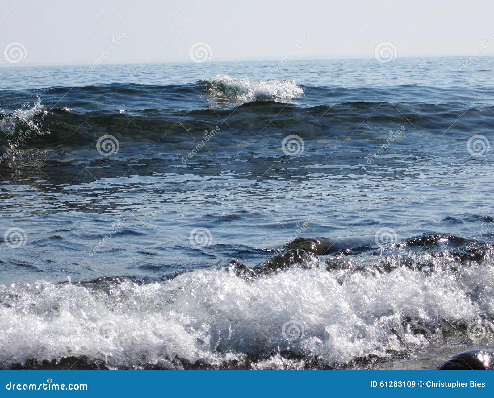 Stones in a Wave stock image. Image of superior, stone - 61283109
