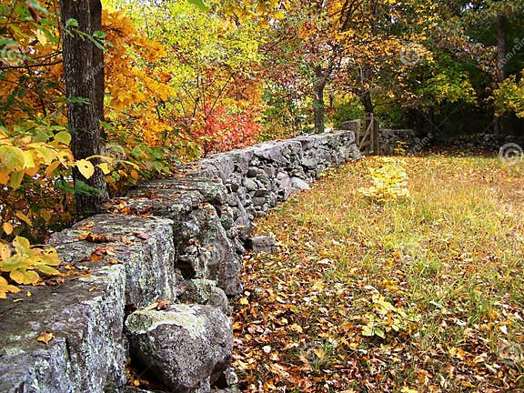 Stonewall in fall. stock image. Image of rock, green, trees - 424281
