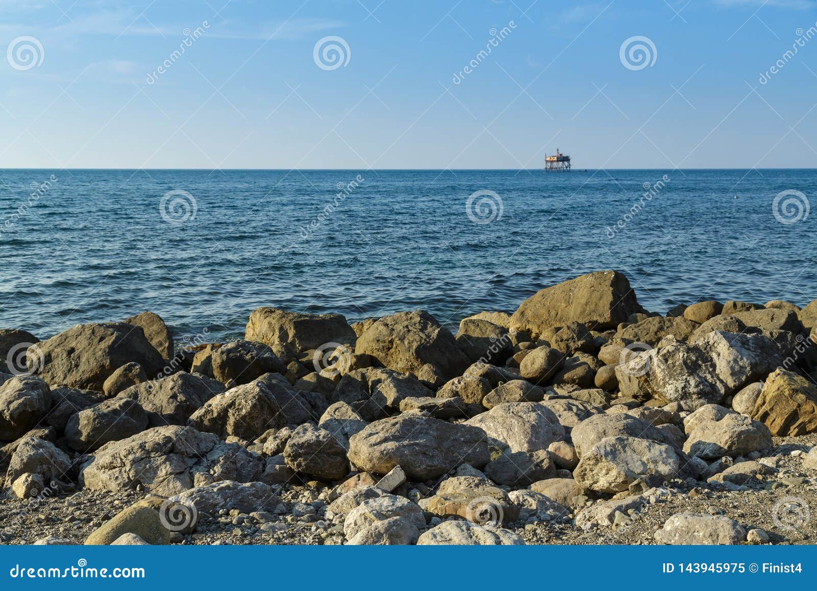 Stony Seashore Illuminated by the Morning Sun. Stock Image - Image of ...
