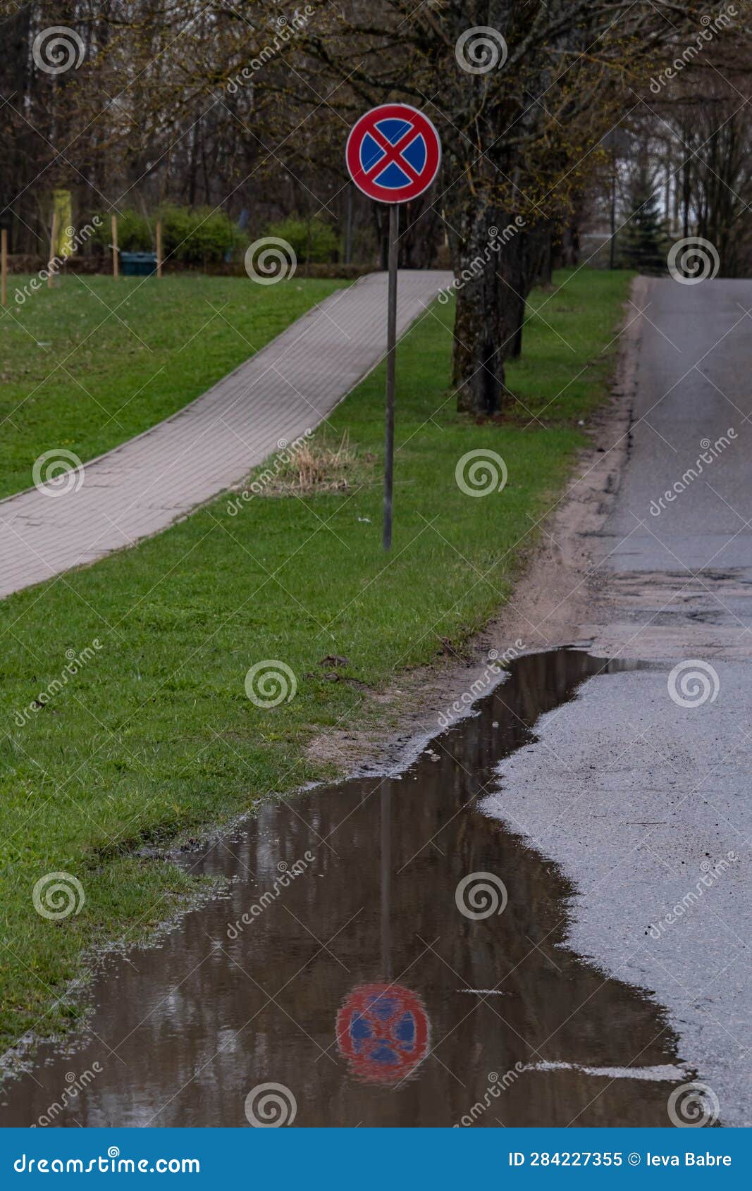 Stop Banned - a Reflection of a Road Sign in a Puddle Stock Image ...