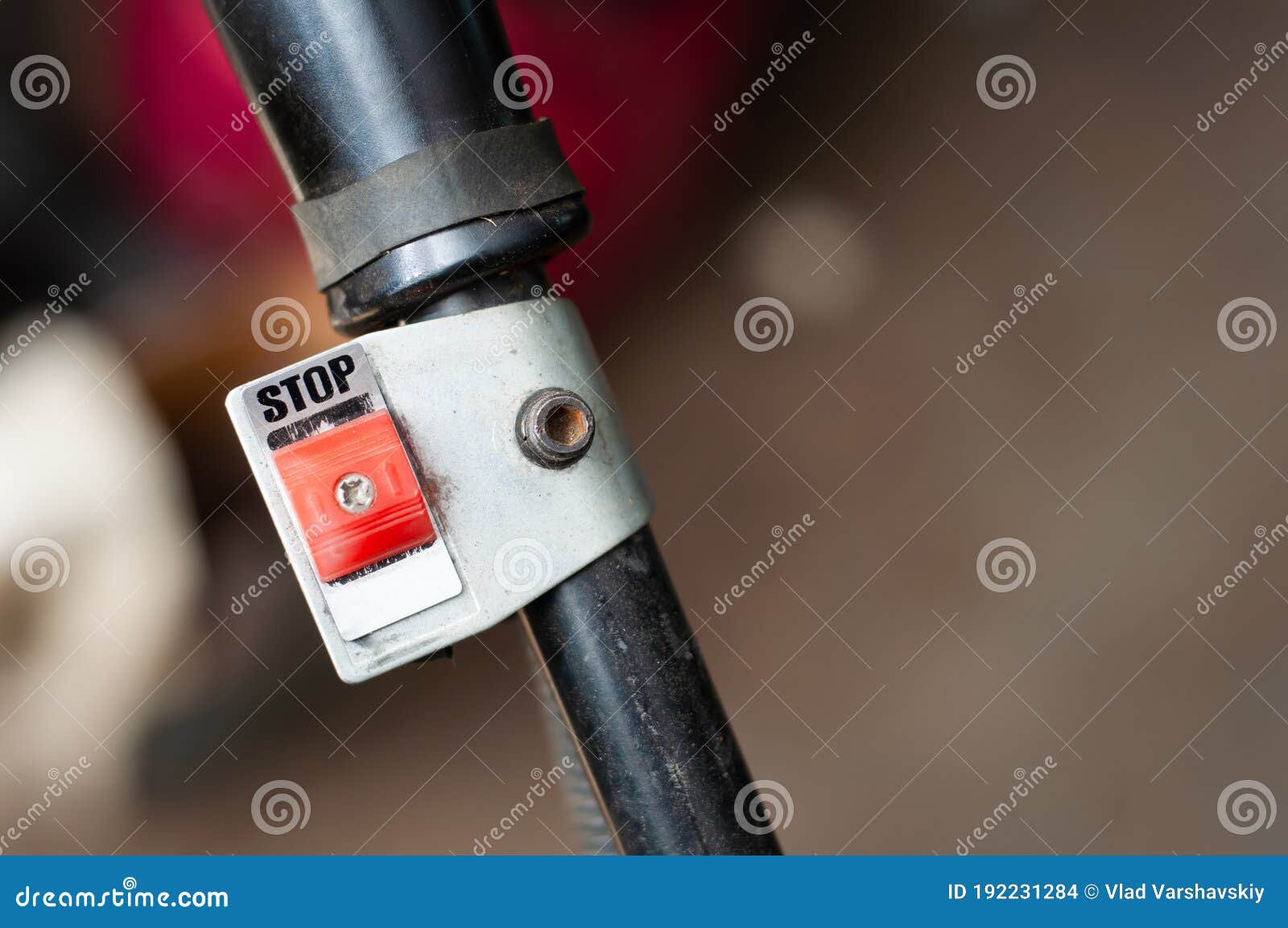 The Stop Button is Red. Ignition Button on the Handle of the Walk ...