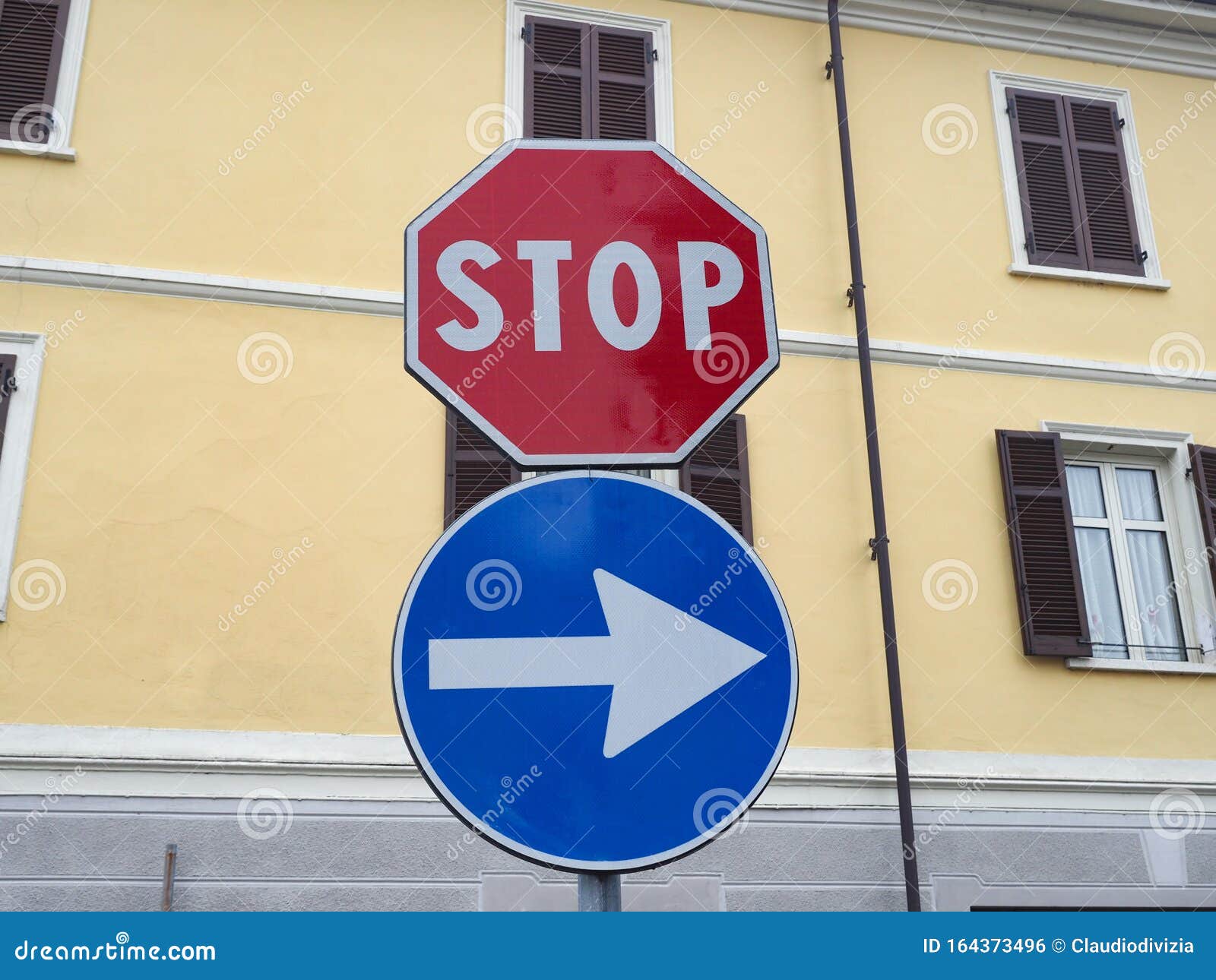 Stop and direction sign stock photo. Image of street - 164373496