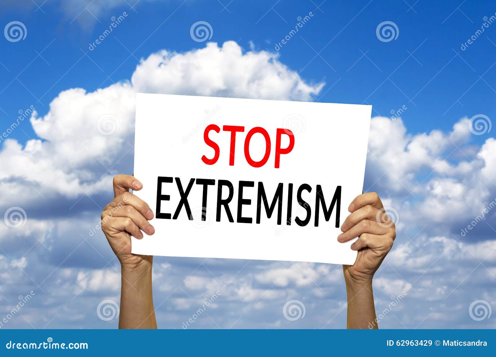 STOP EXTREMISM Card in Hand Against Blue Sky with Clouds. Stock Image ...