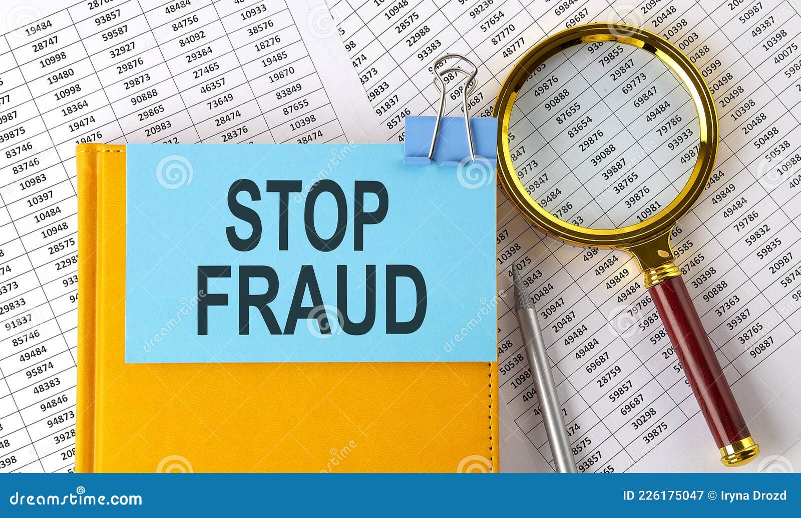 STOP FRAUD Text on Sticker on Notebook with Magnifier and Chart ...
