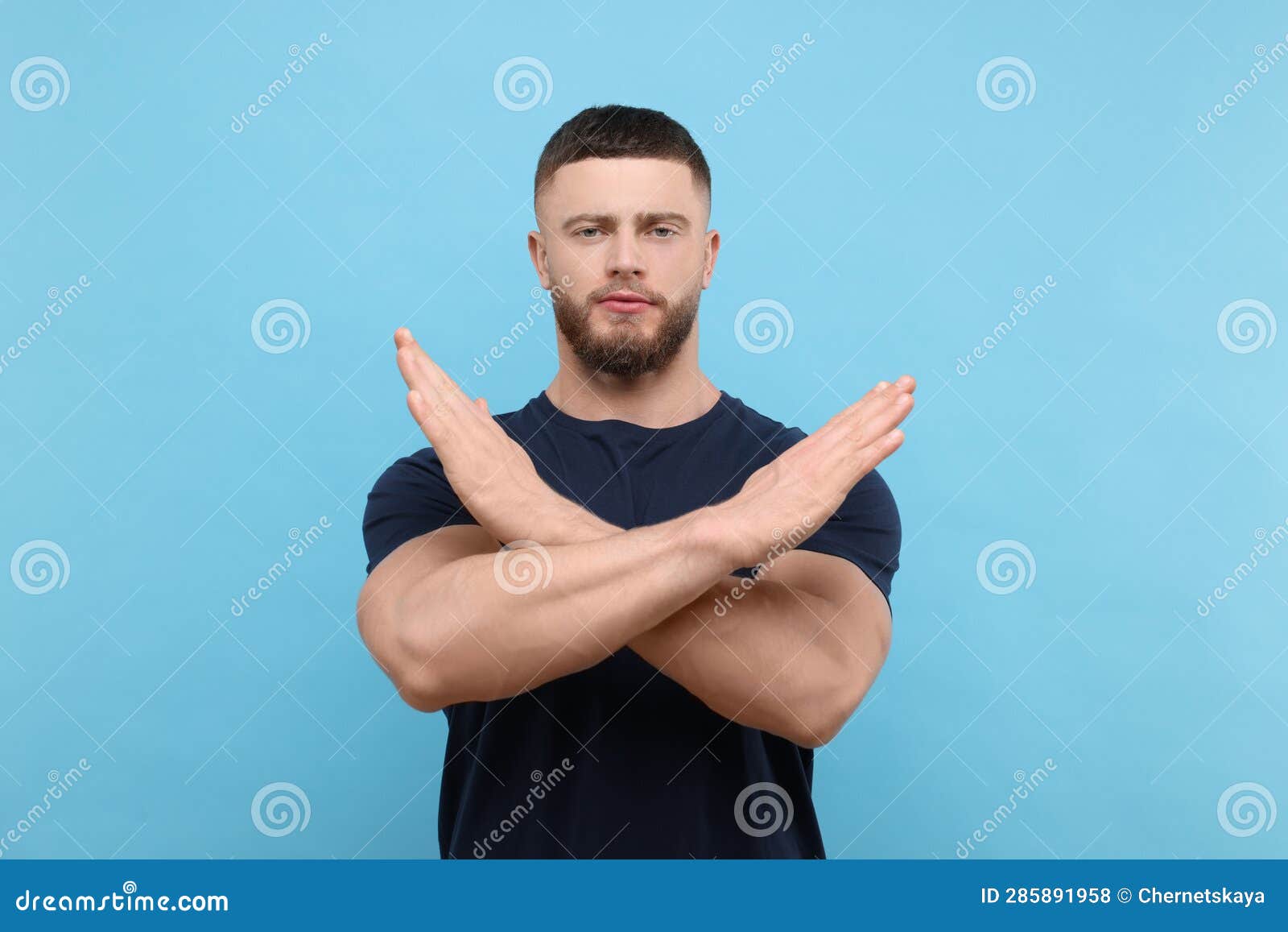 Stop Gesture. Man with Crossed Hands on Light Blue Background Stock ...