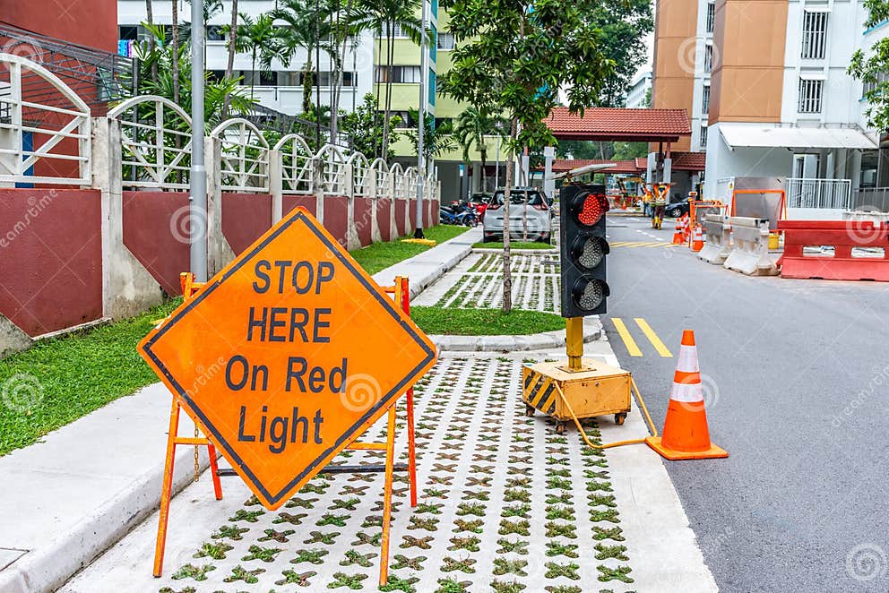 Stop Here on Red Traffic Light Sign. Stock Photo - Image of posted ...