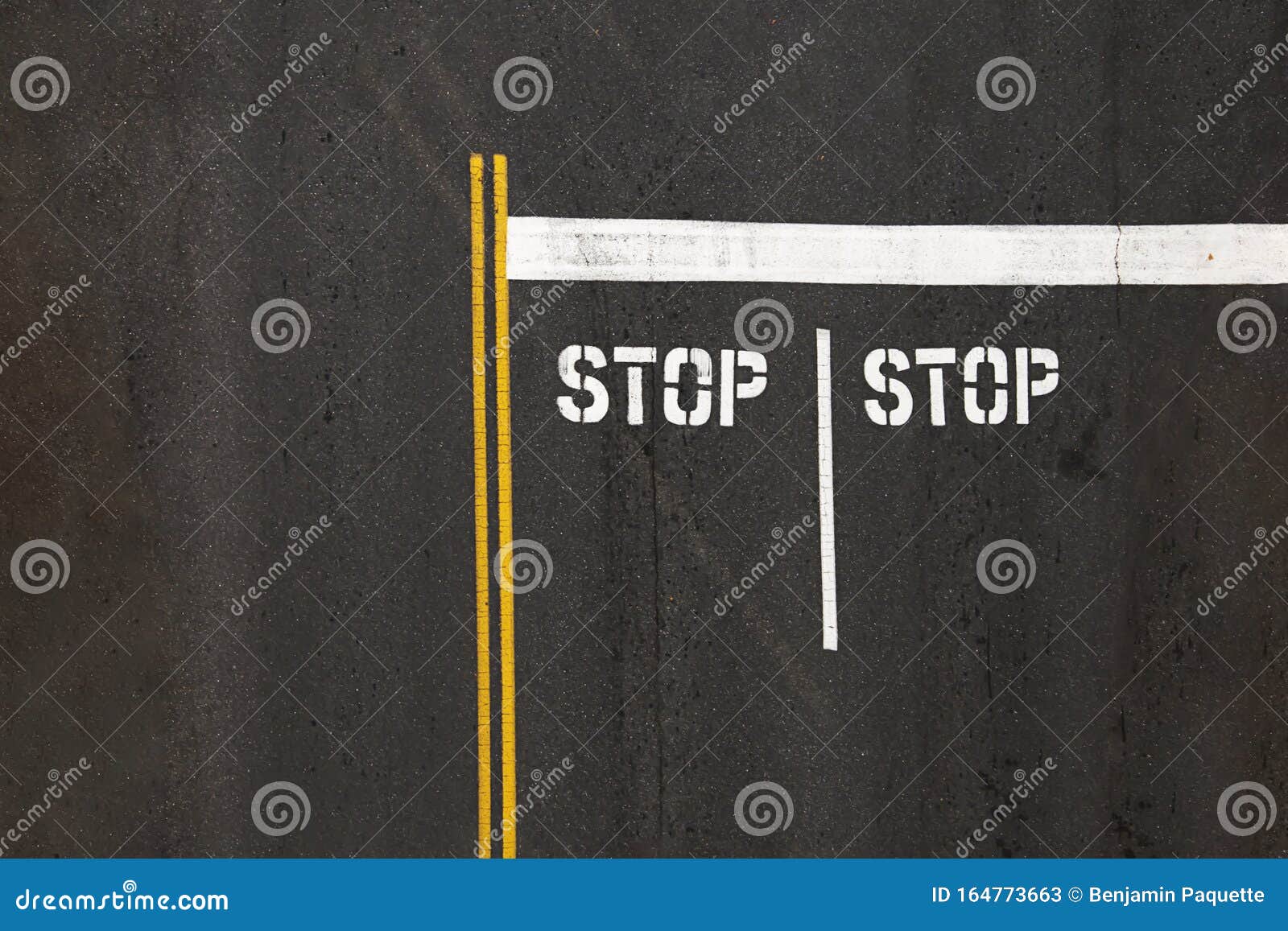Stop Lines in the Middle of a Road Stock Image - Image of acronym ...
