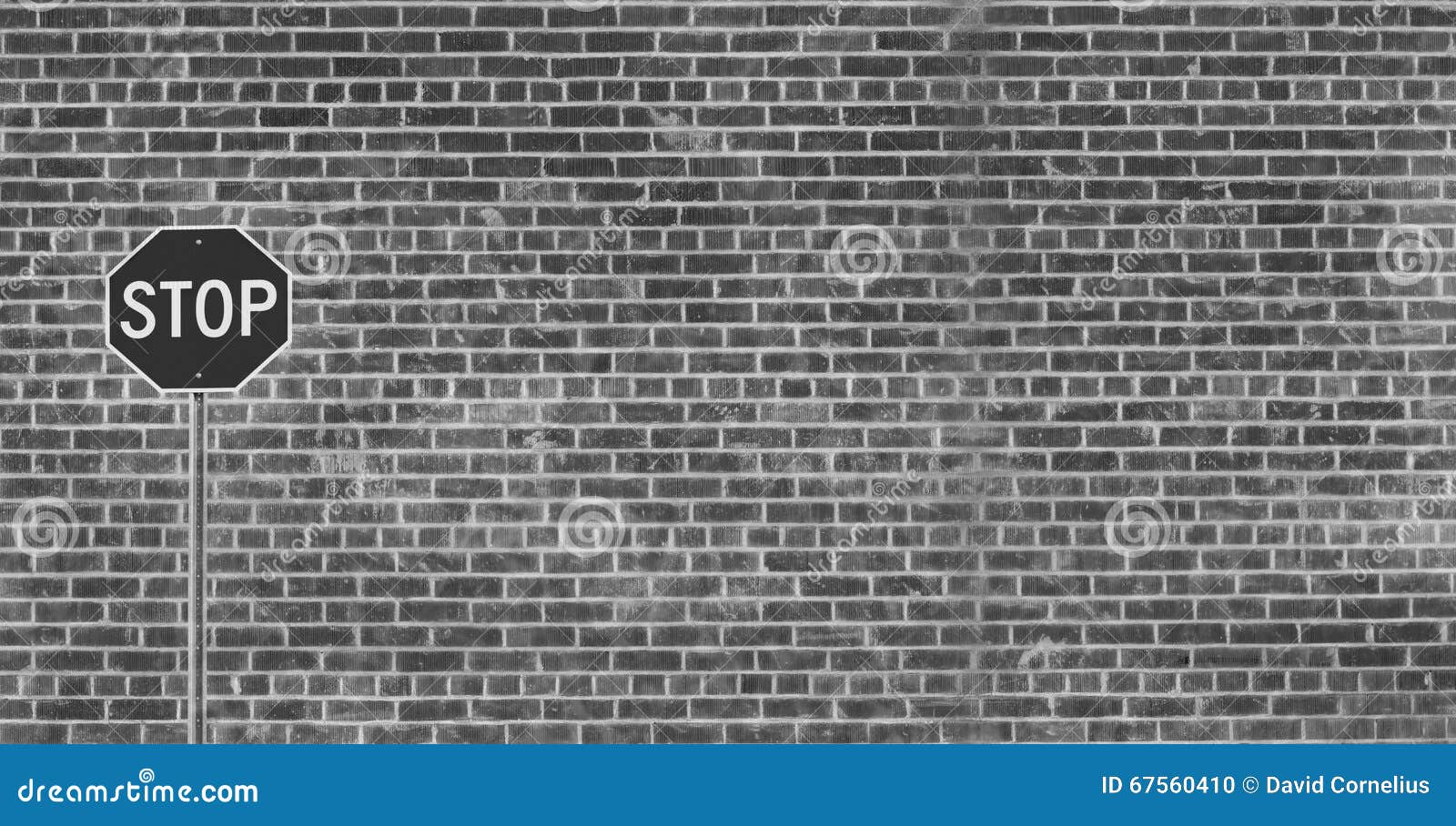 Stop Sign in Front of Brick Wall Stock Photo - Image of sign ...