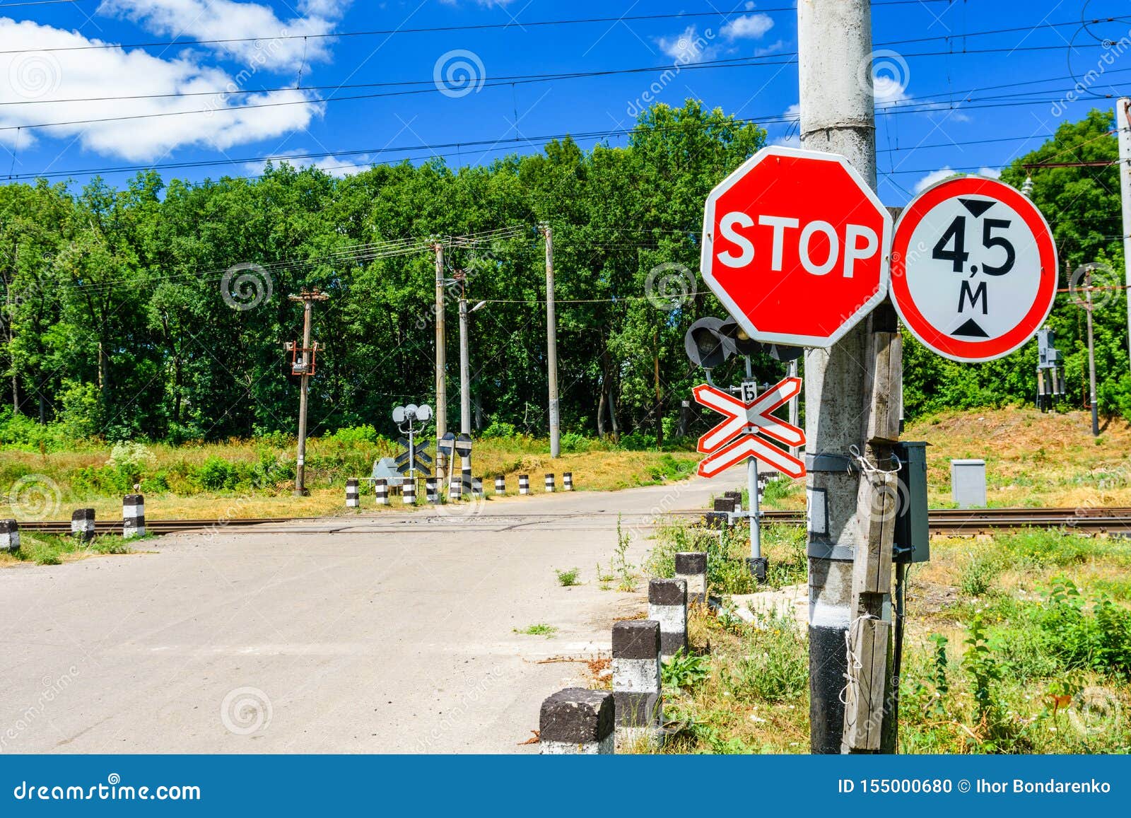 Stop Sign in Front of the Railroad Crossing Stock Photo - Image of ...