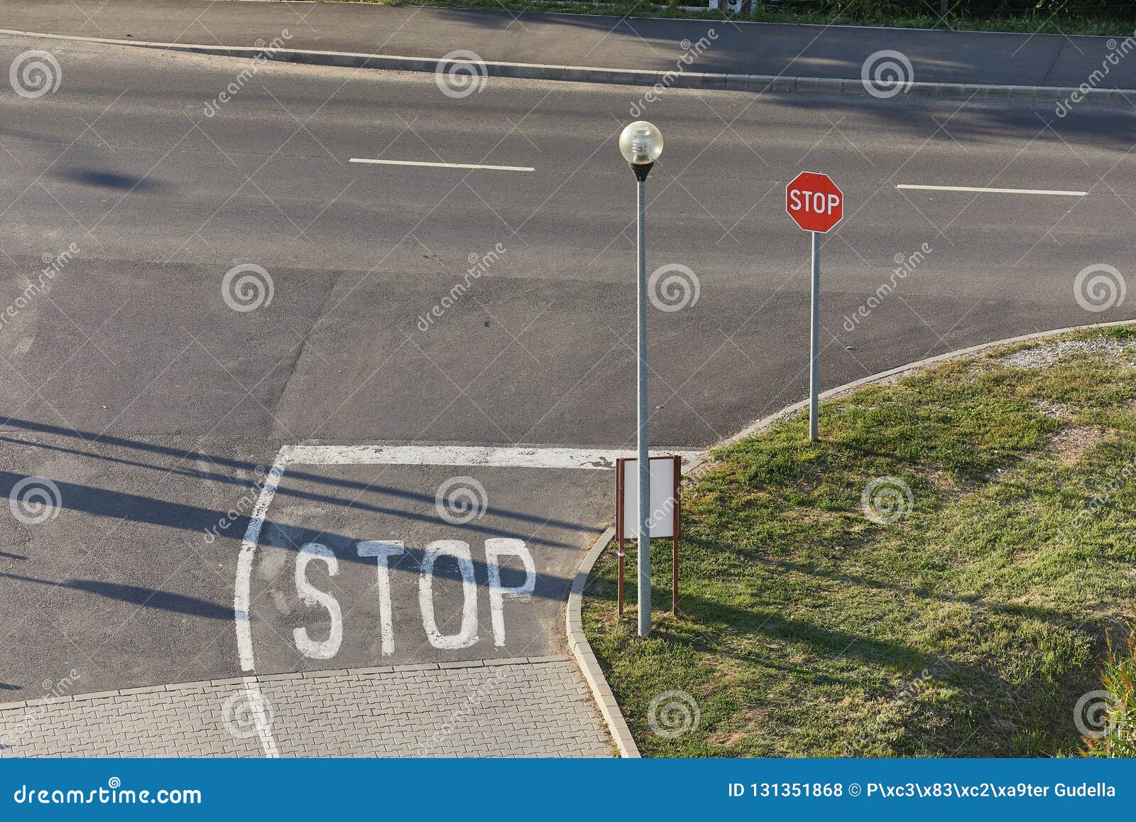 Stop Sign at an Intersection Stock Photo - Image of surface, road ...