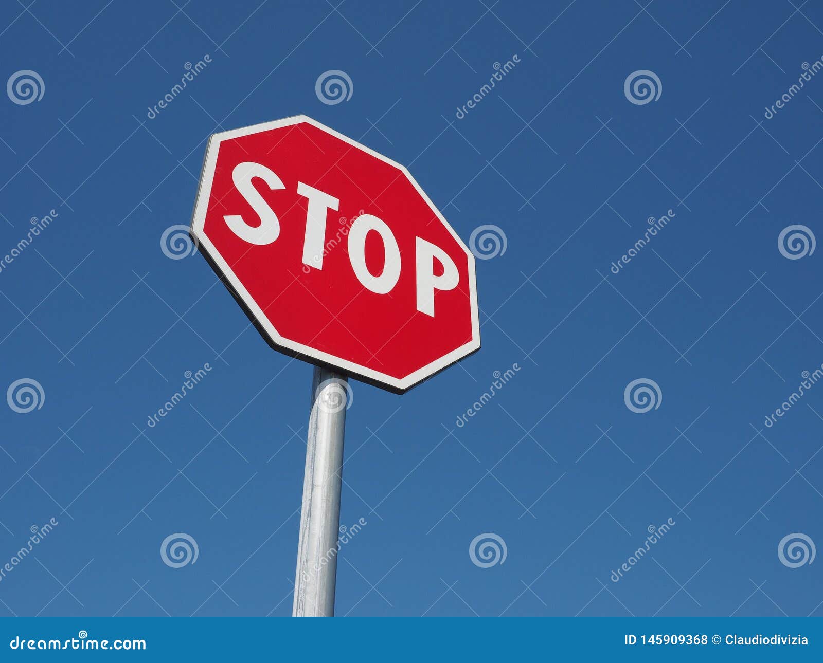 Stop sign over blue sky stock photo. Image of safety - 145909368