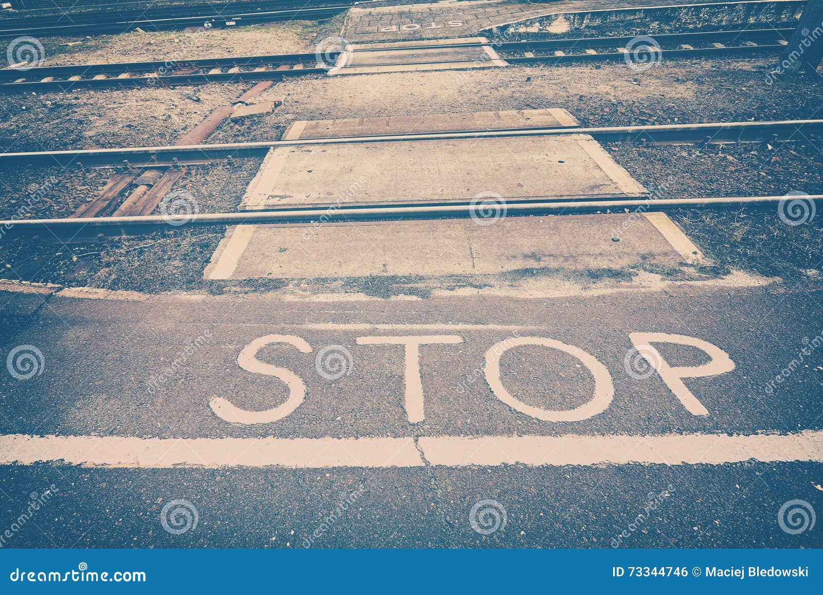 Stop Sign Painted in Front of Railroad Tracks. Stock Photo - Image of ...
