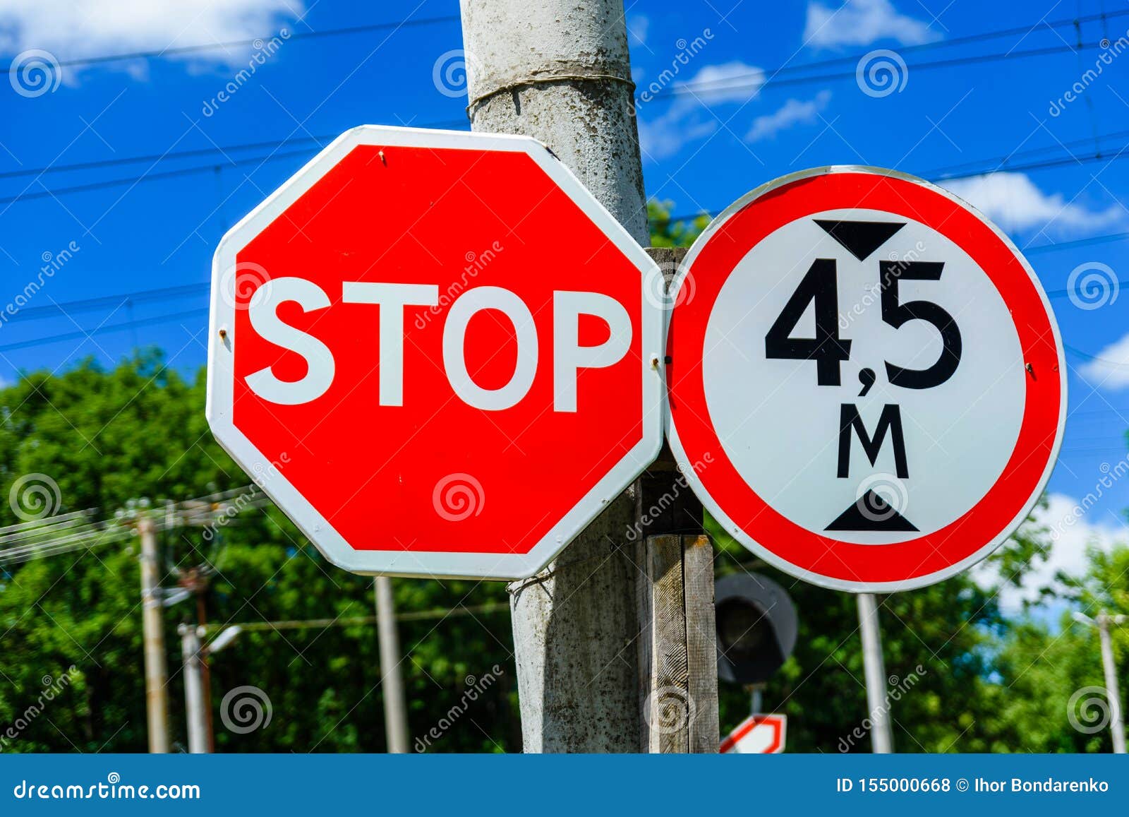 Stop Sign on a Post at Roadside Against Blue Sky Stock Photo - Image of ...
