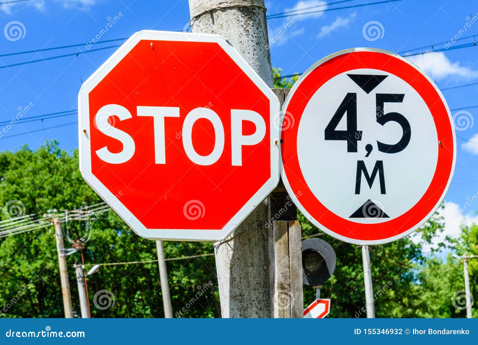 Stop Sign on a Post at Roadside Against Blue Sky Stock Photo - Image of ...