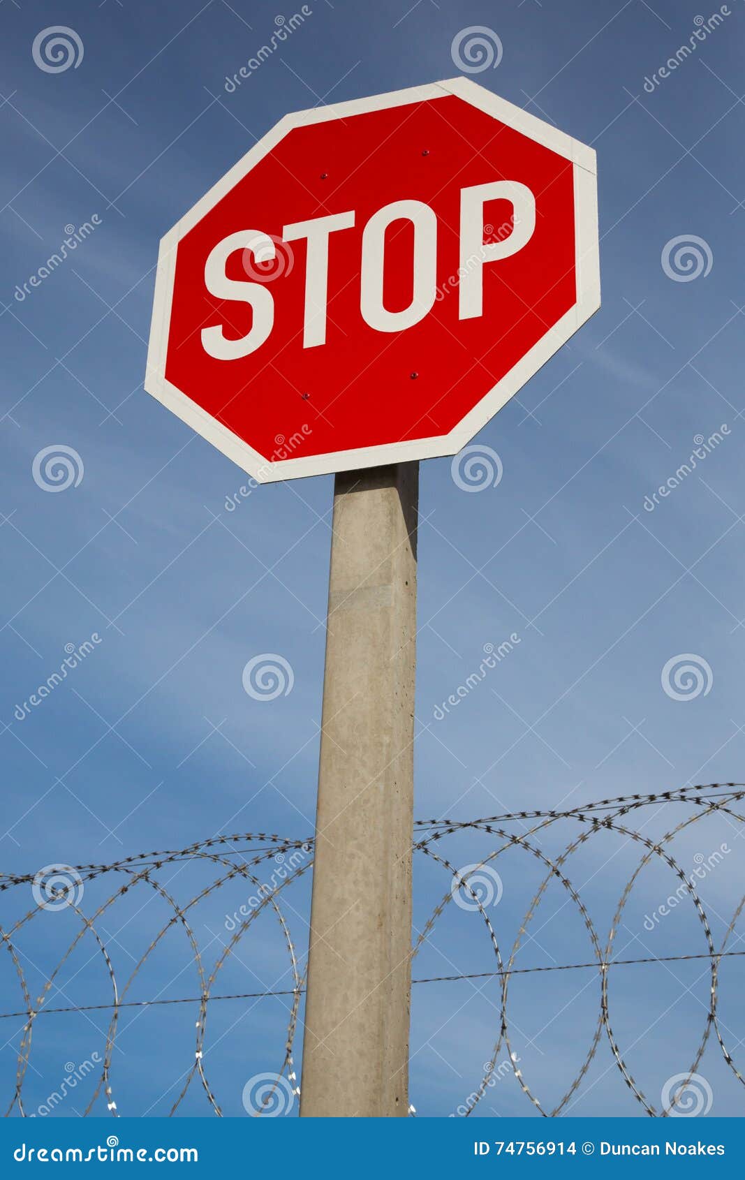 Stop Sign and Razor Wire stock photo. Image of caution - 74756914