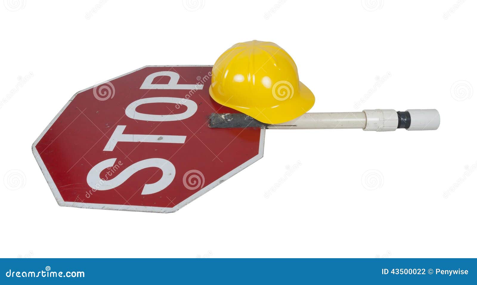 Stop Sign on a Short Pole with a Construction Hat Stock Photo - Image ...