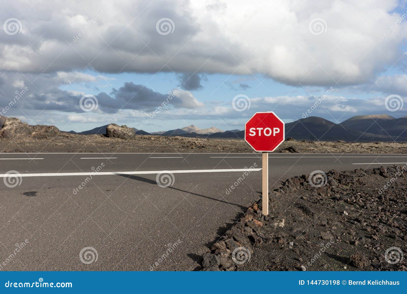 Stop Sign on the Side of an Road Stock Photo - Image of blue, speed ...