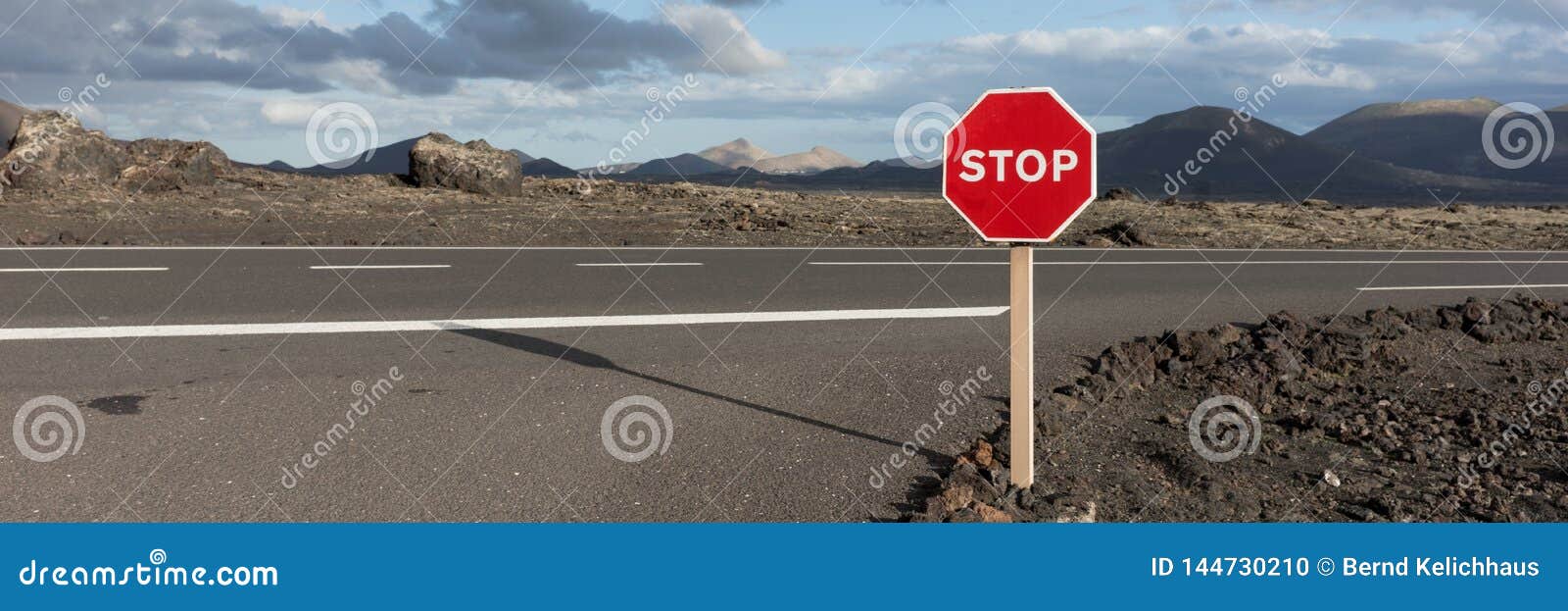 Stop Sign on the Side of an Road Stock Photo - Image of highway, clouds ...