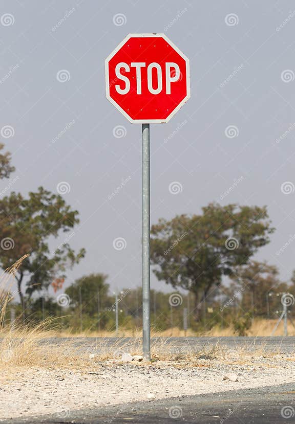 Stop Sign at the Side of the Road Stock Photo - Image of halt, blue ...