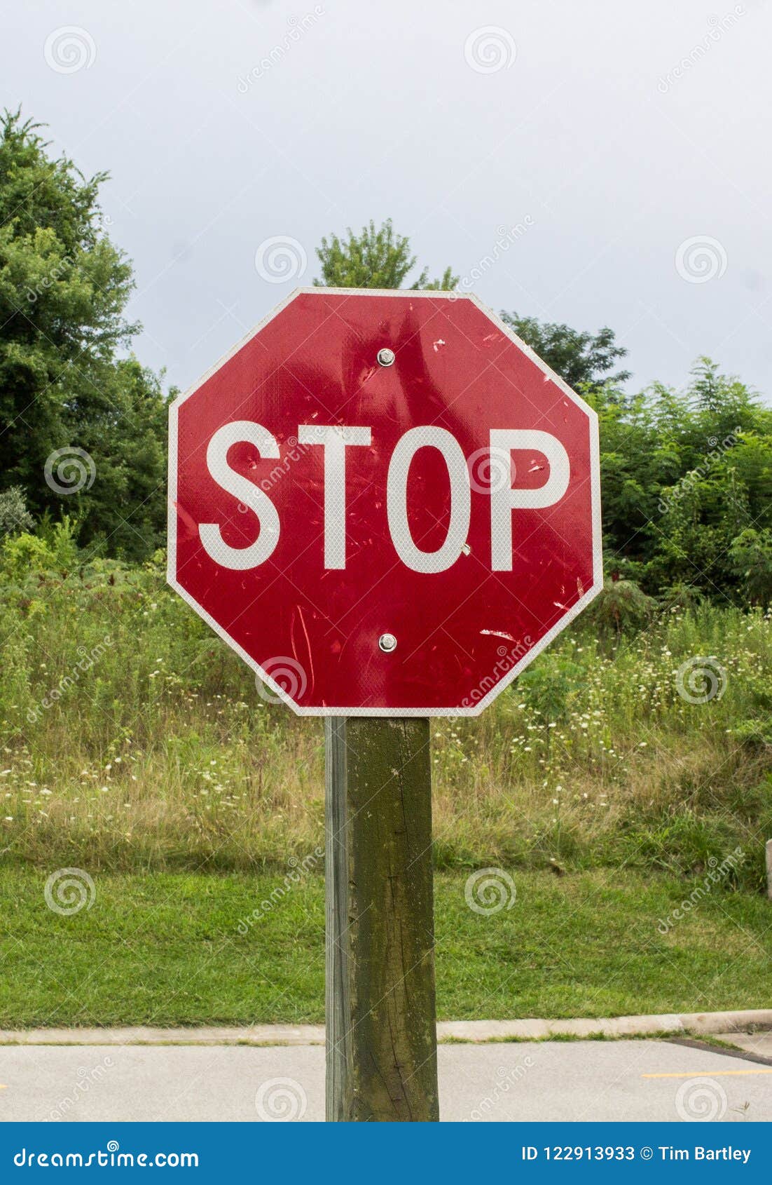 Stop sign on the sidewalk stock image. Image of sign - 122913933