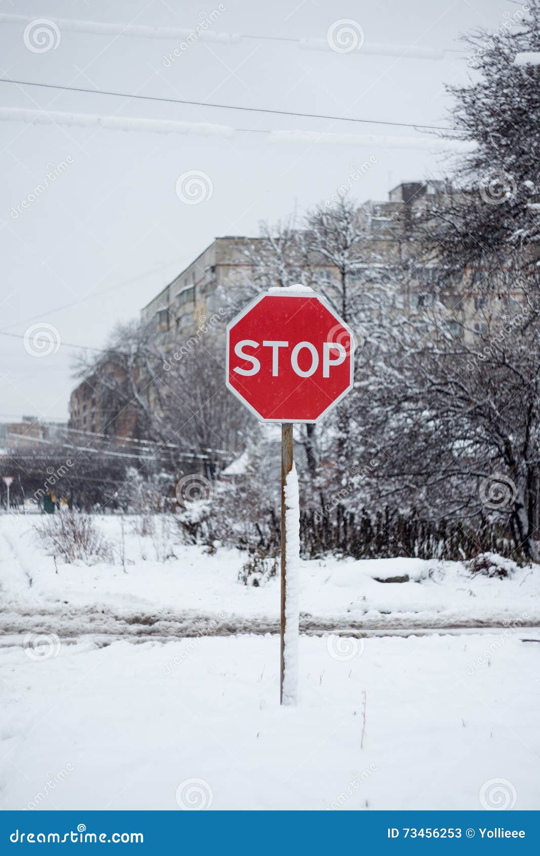 Stop sign on a snowy road stock image. Image of post - 73456253