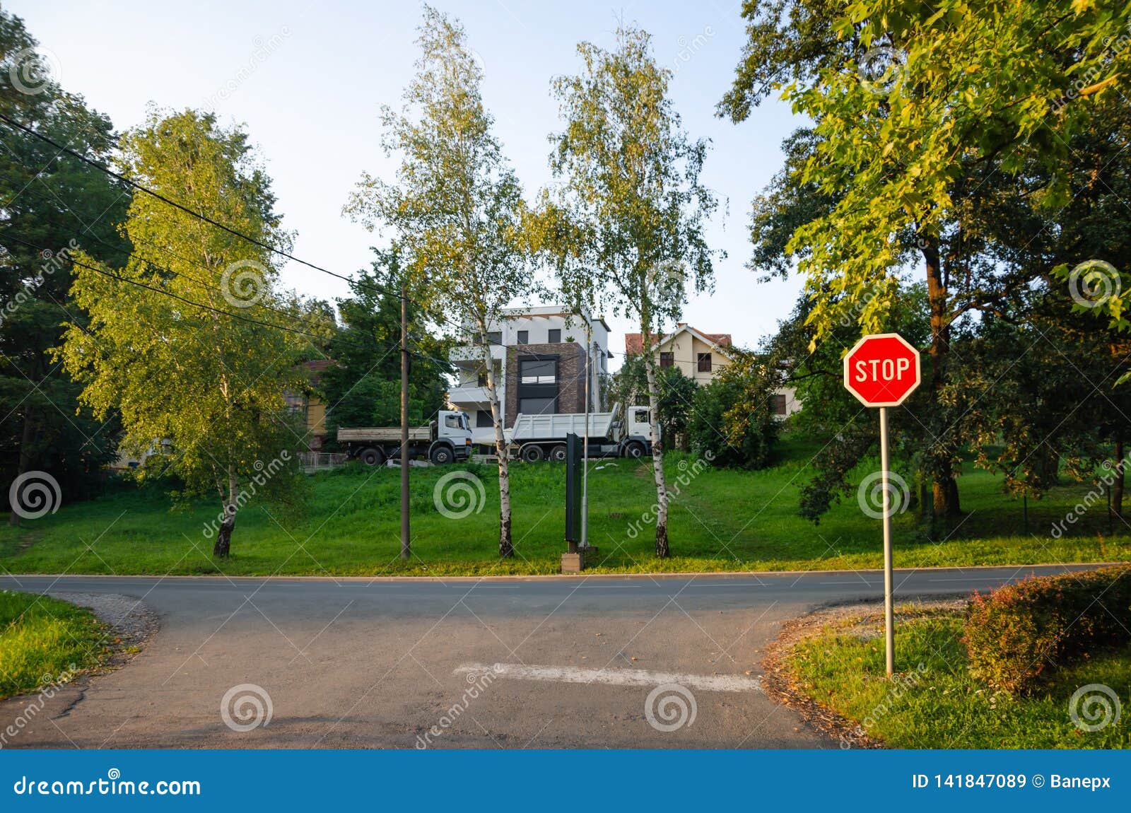 Stop sign and a street stock image. Image of signal - 141847089